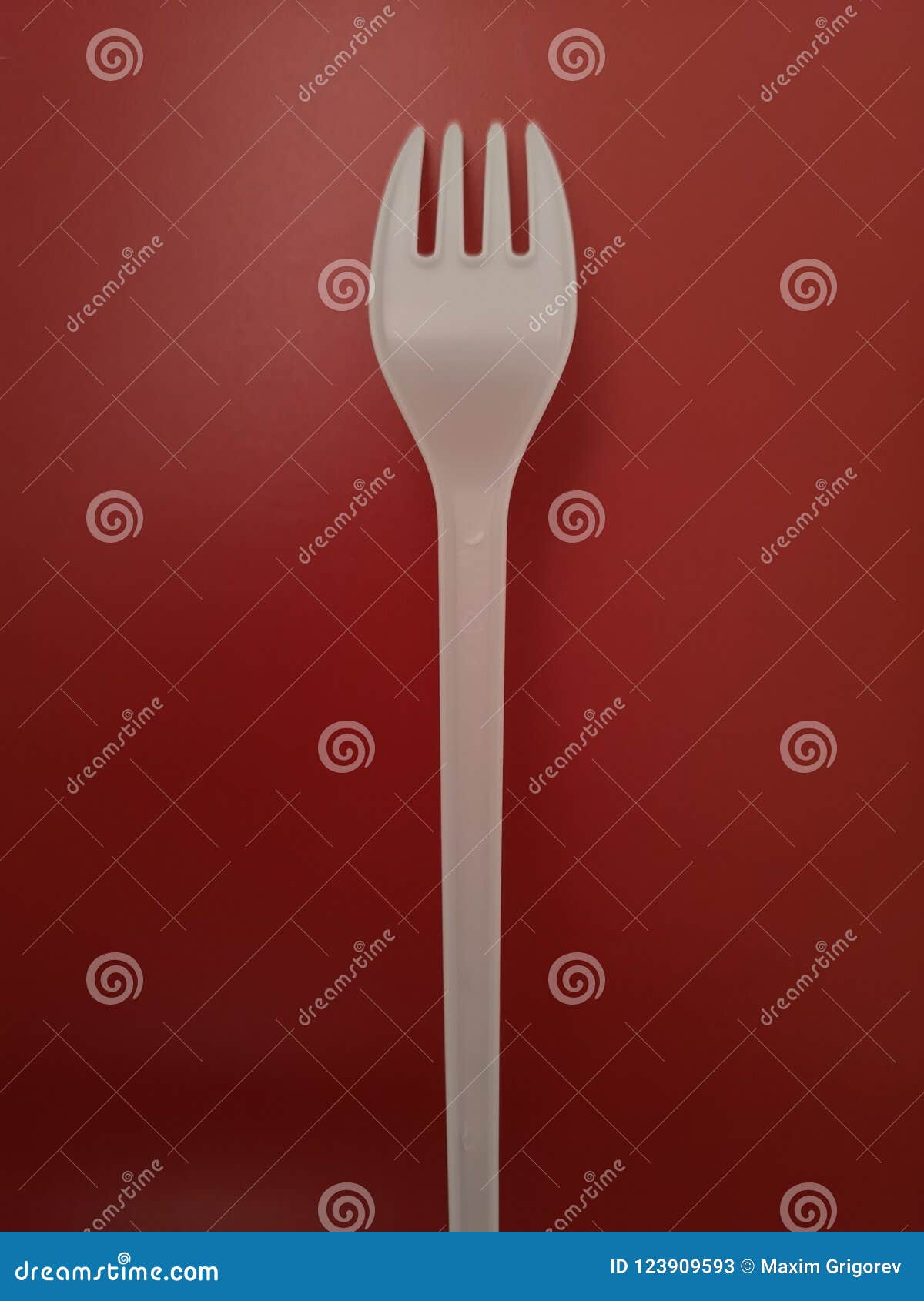 Fork on the red background stock image. Image of background - 123909593