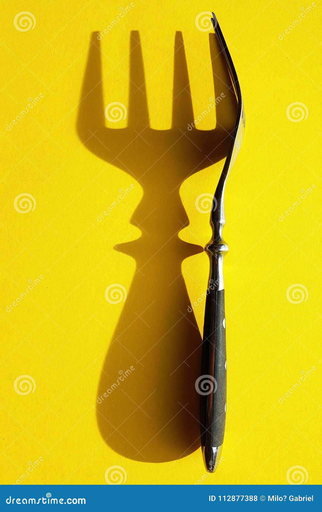 A Fork Shadow Reflecting On The Table Stock Photo | CartoonDealer.com ...