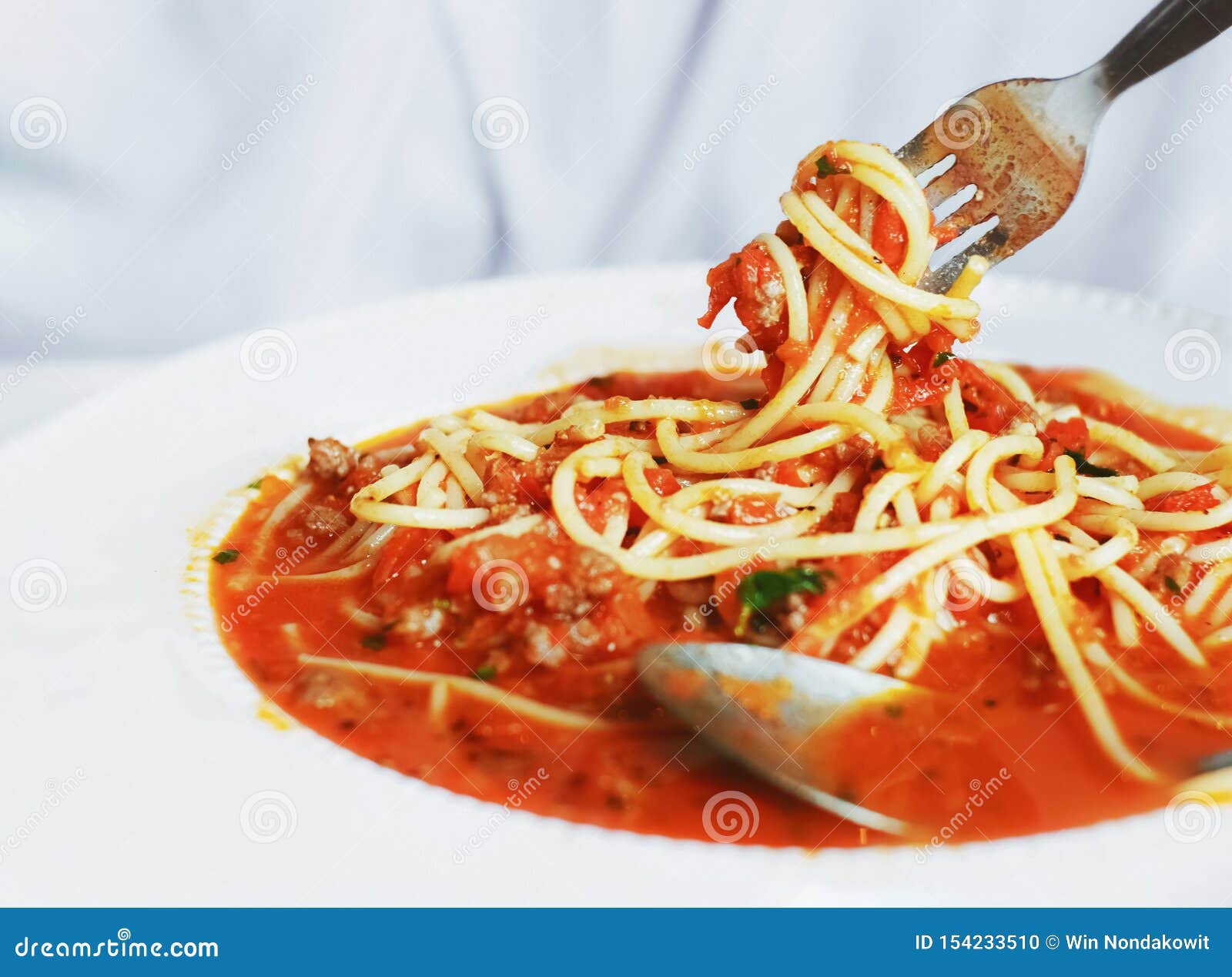 Spaghetti Meat Sauce. Hand Using Fork Eating Spaghetti Royalty-Free ...