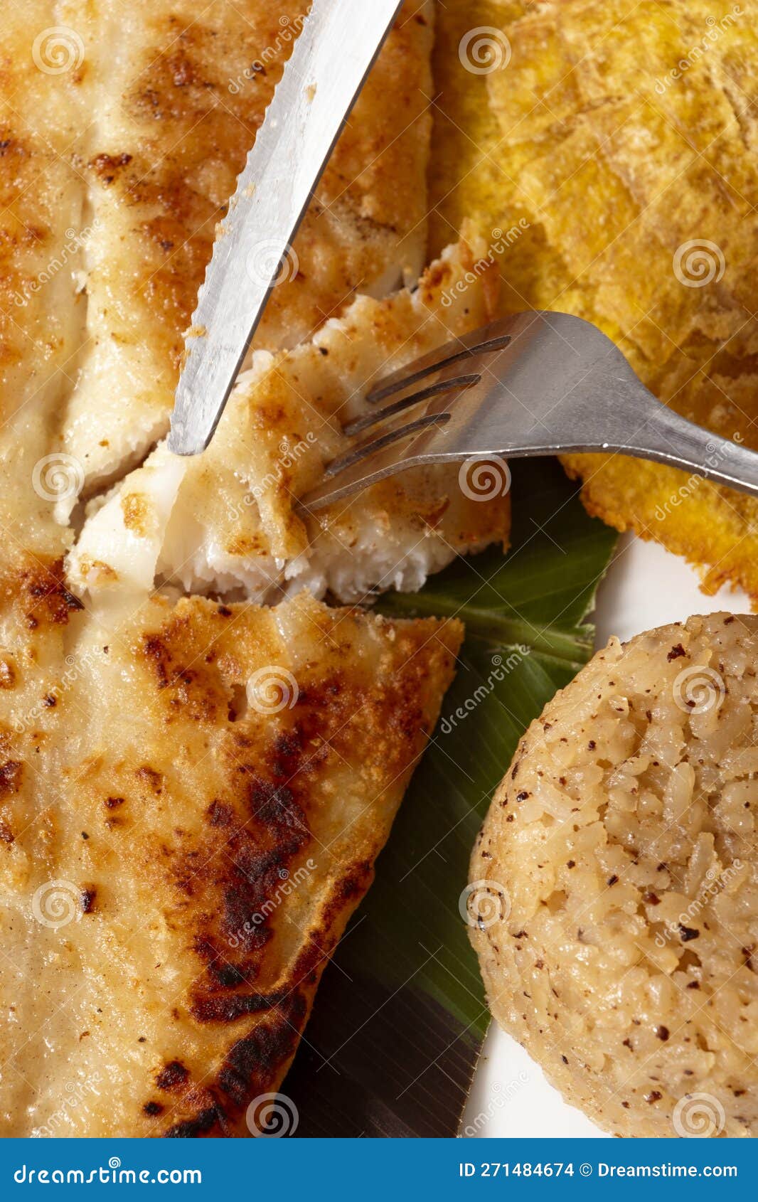 Fork Splitting a Piece of Fish Fillet Stock Photo - Image of fried ...
