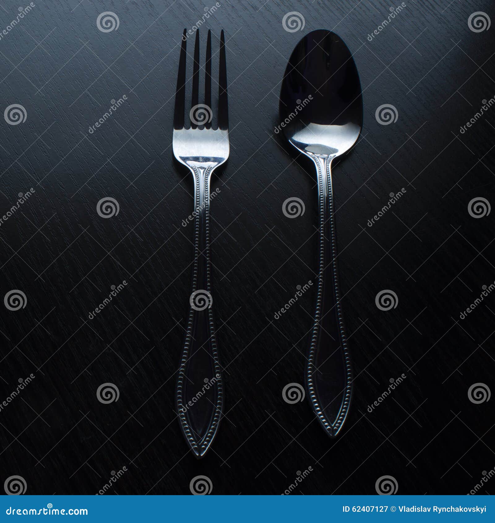 Fork and Spoon on a Black Table Stock Image - Image of menu, black ...