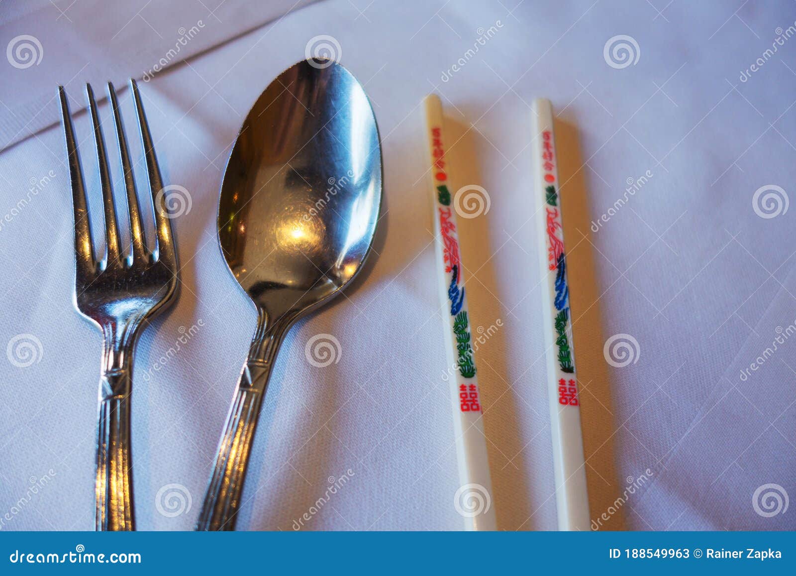 A Fork and a Spoon and Chinese Chopsticks Stock Image - Image of ...