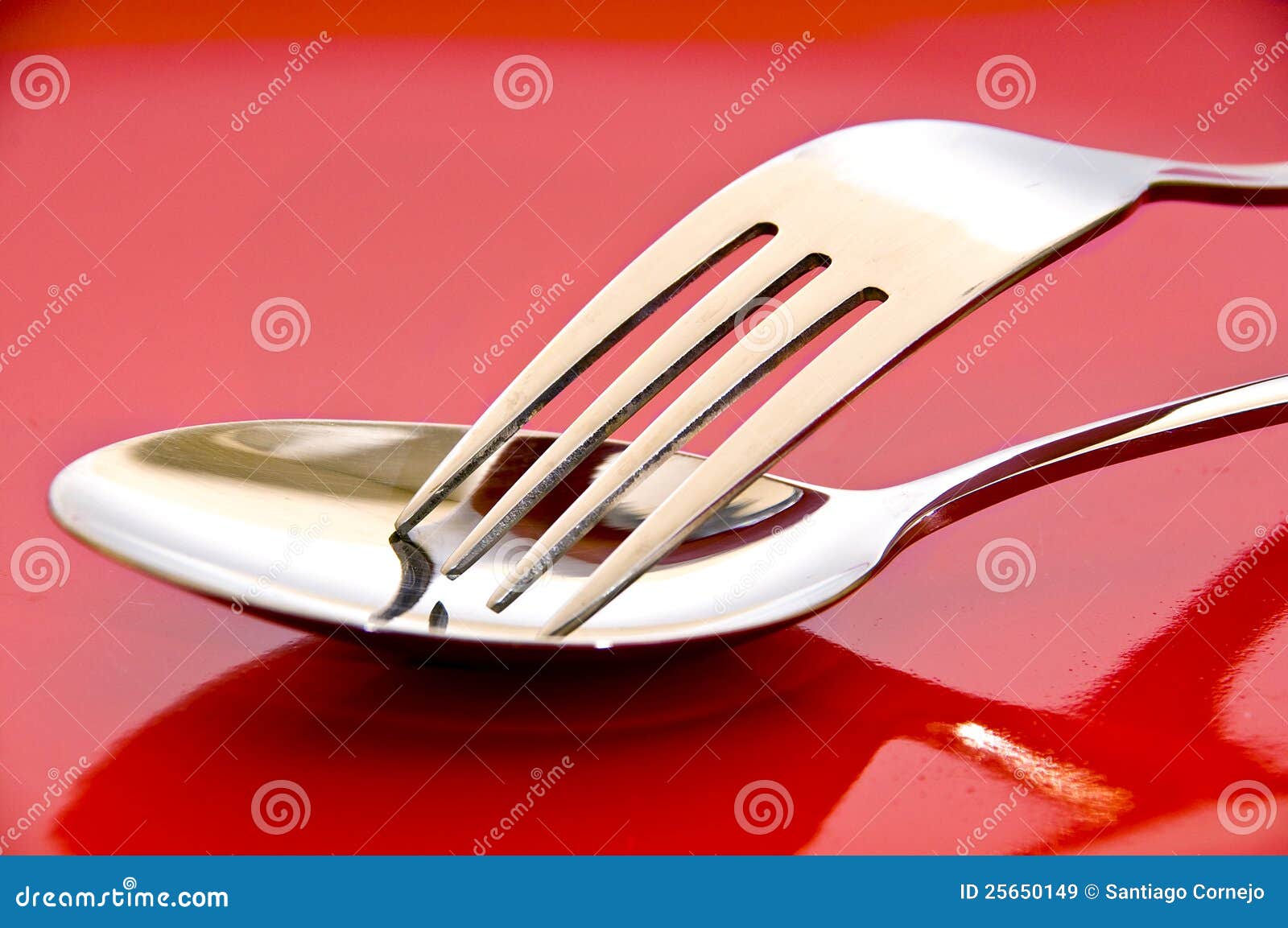 Fork and Spoon Over a Red Plate Stock Image - Image of restaurant ...
