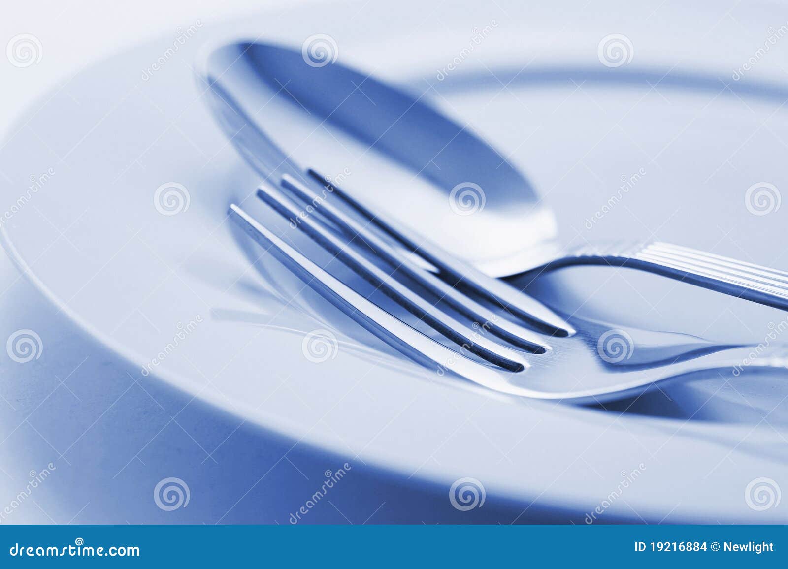 Fork and Spoon on Plate stock photo. Image of objects - 19216884