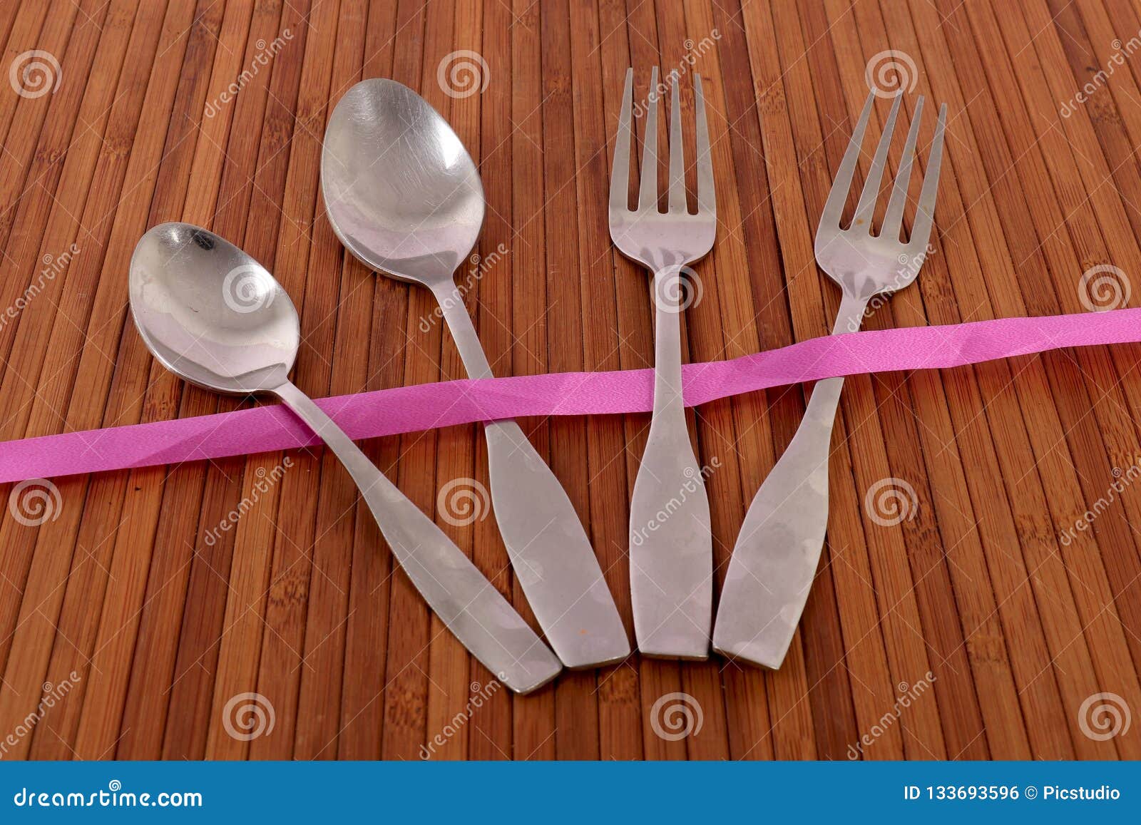 Fork and spoons stock photo. Image of meta, ribbon, spoons - 133693596