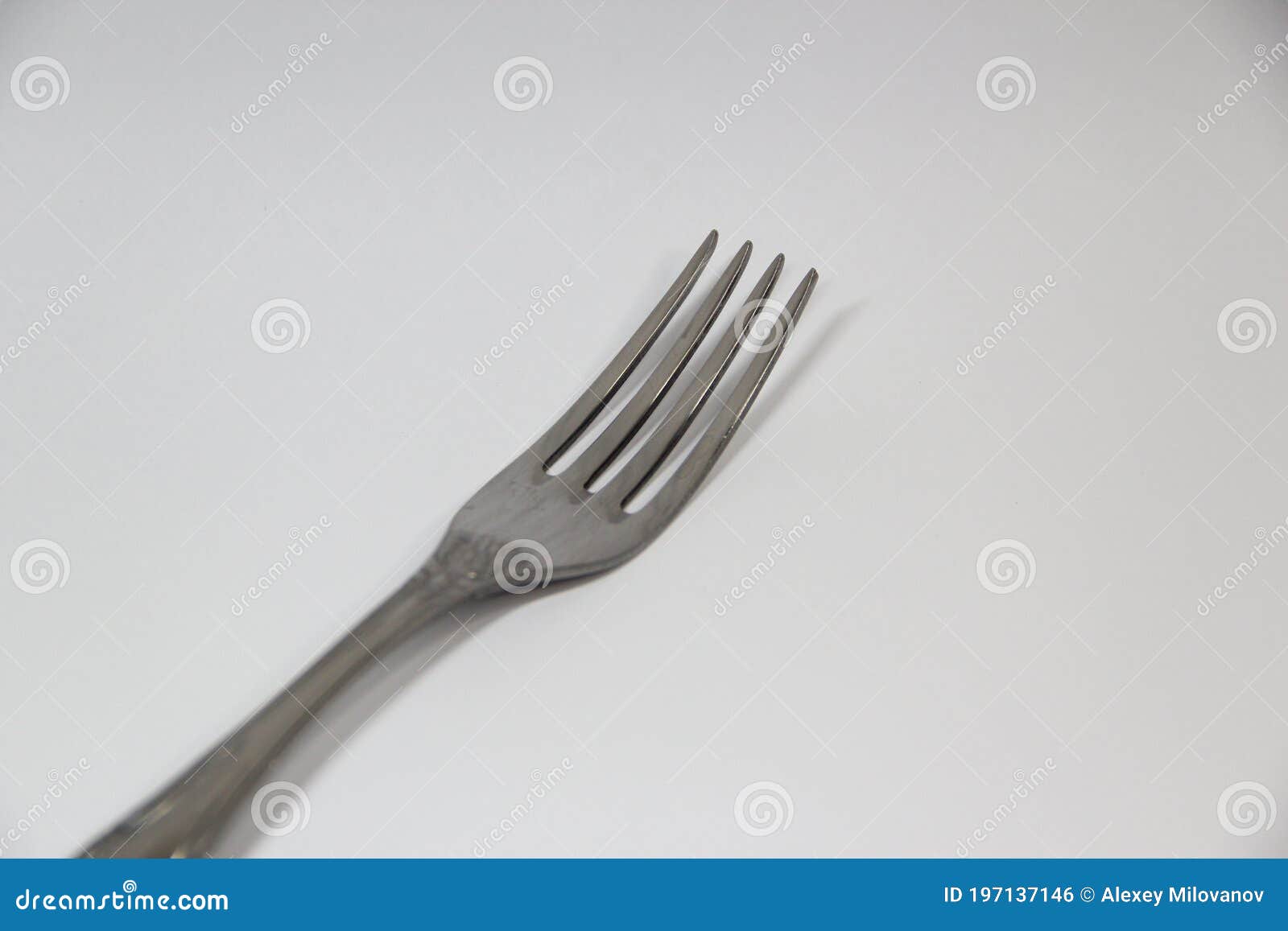 Fork on white background stock photo. Image of kitchen - 197137146