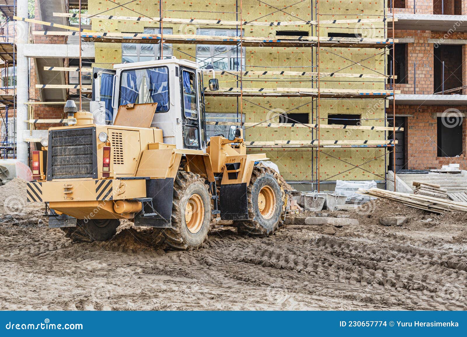 A Forklift at a Construction Site is Lifting a Reinforced Concrete Slab ...