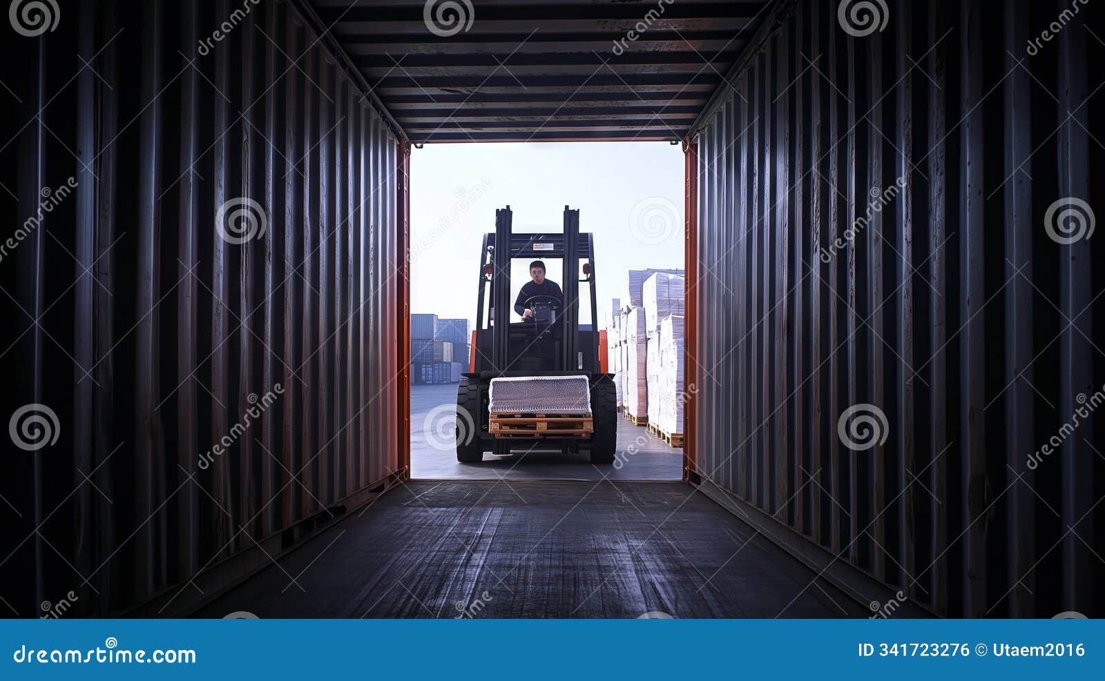 Forklift Driver Entering Intermodal Container with Goods on Pallet ...