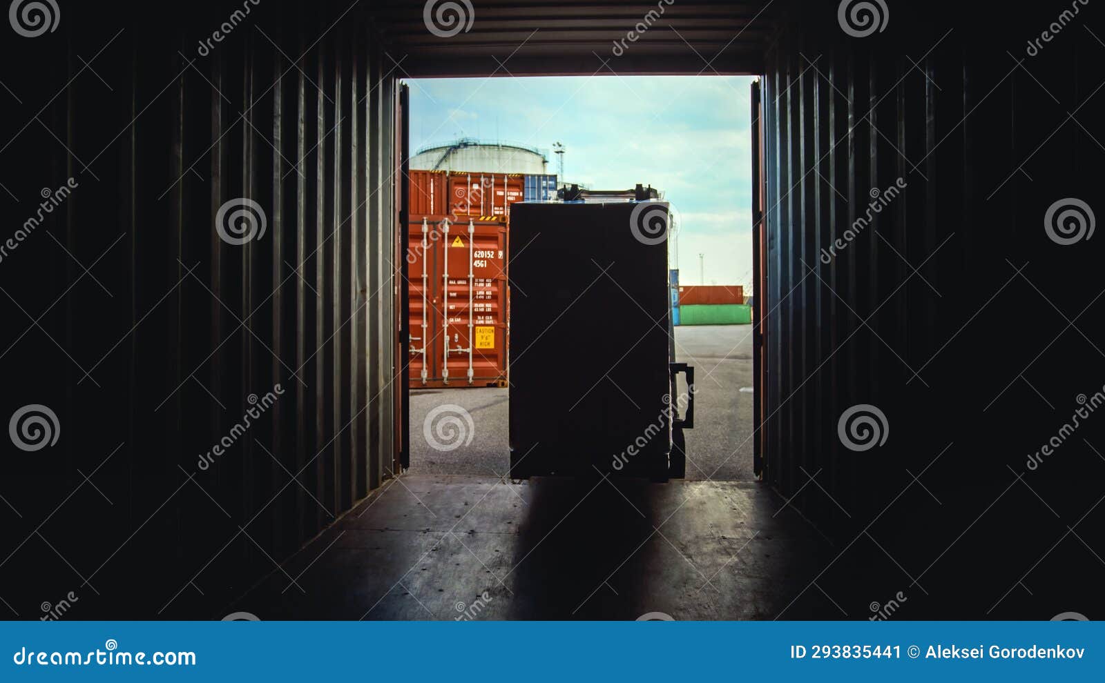 Forklift Driver Loading or Unloading a Shipping Cargo Container with a ...