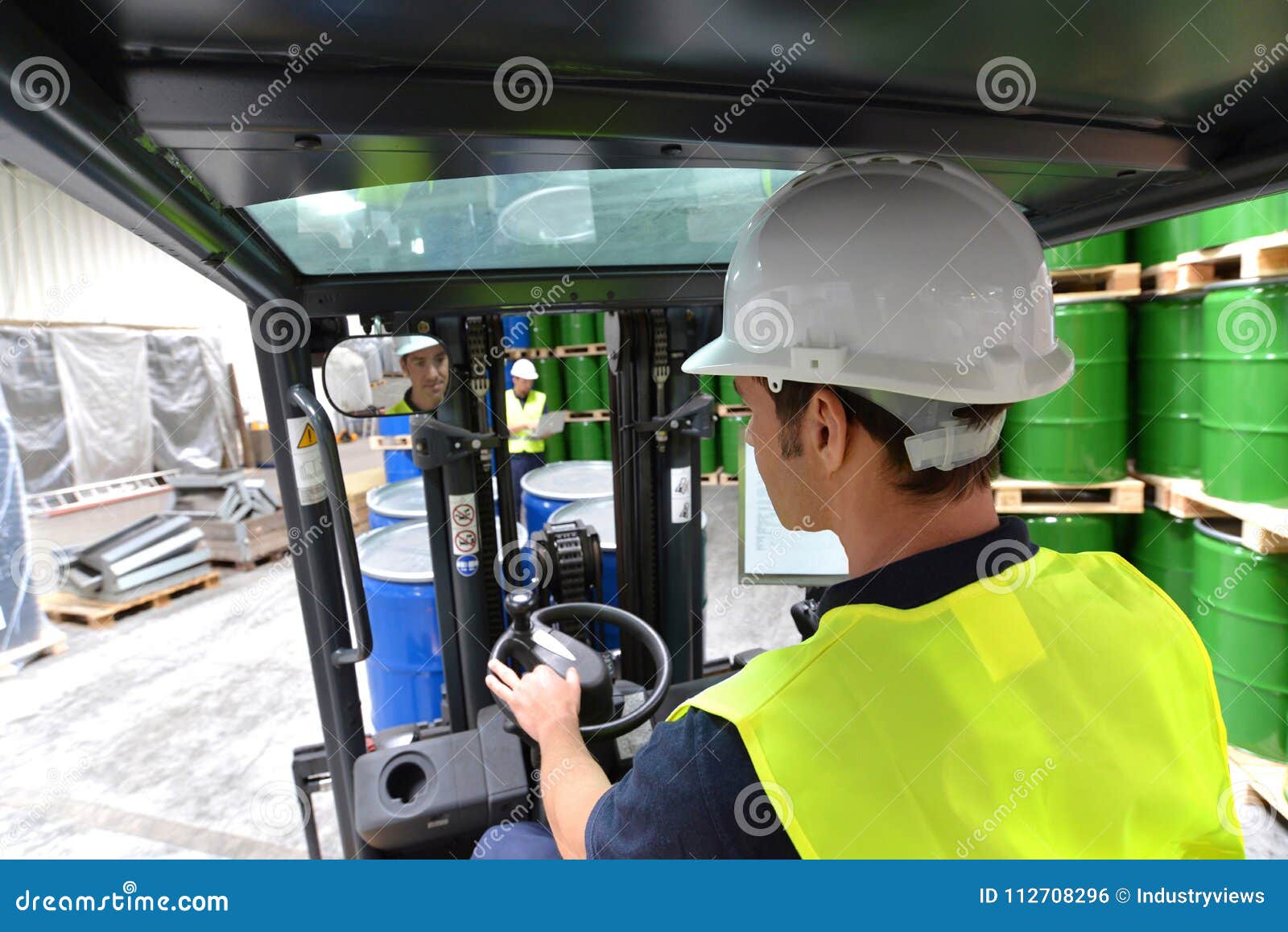Forklift Driver in a Logistics Hall of a Chemical Warehouse Stock Photo ...