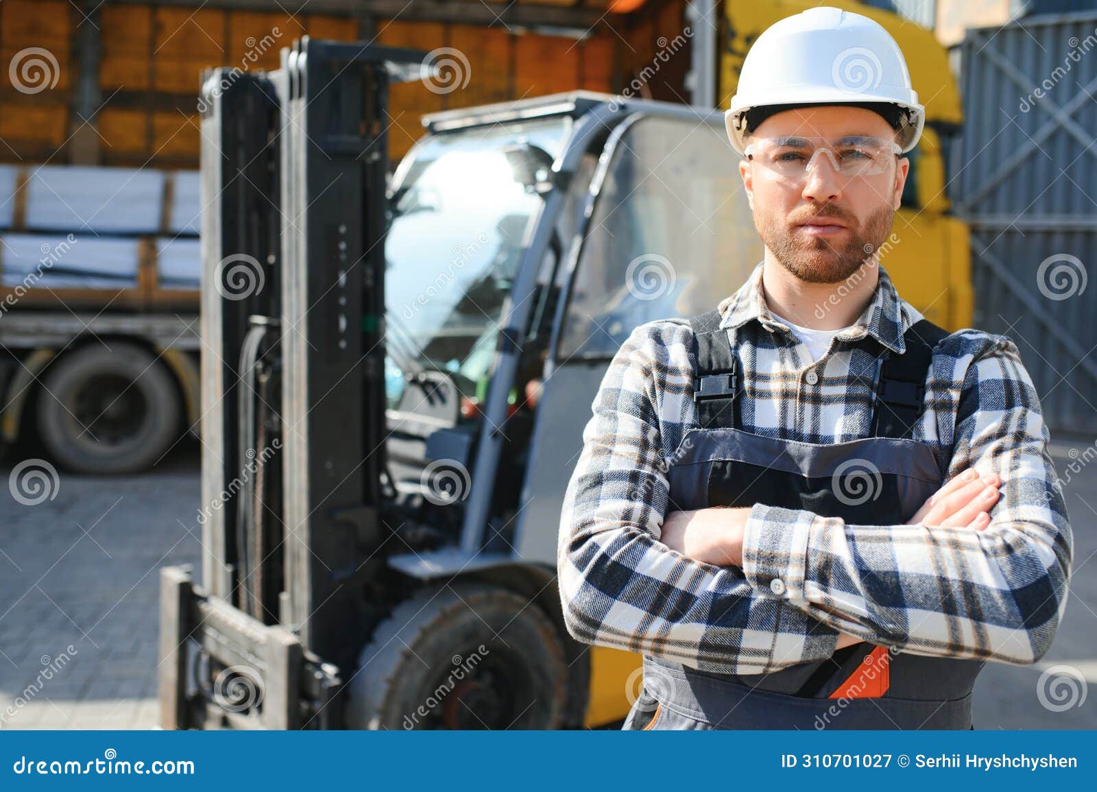 Forklift Driver in Protective Vest and Forklift Standing at Warehouse ...