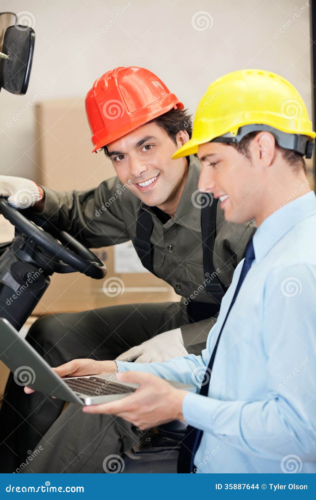 Forklift Driver with Supervisor Using Laptop Stock Photo - Image of ...