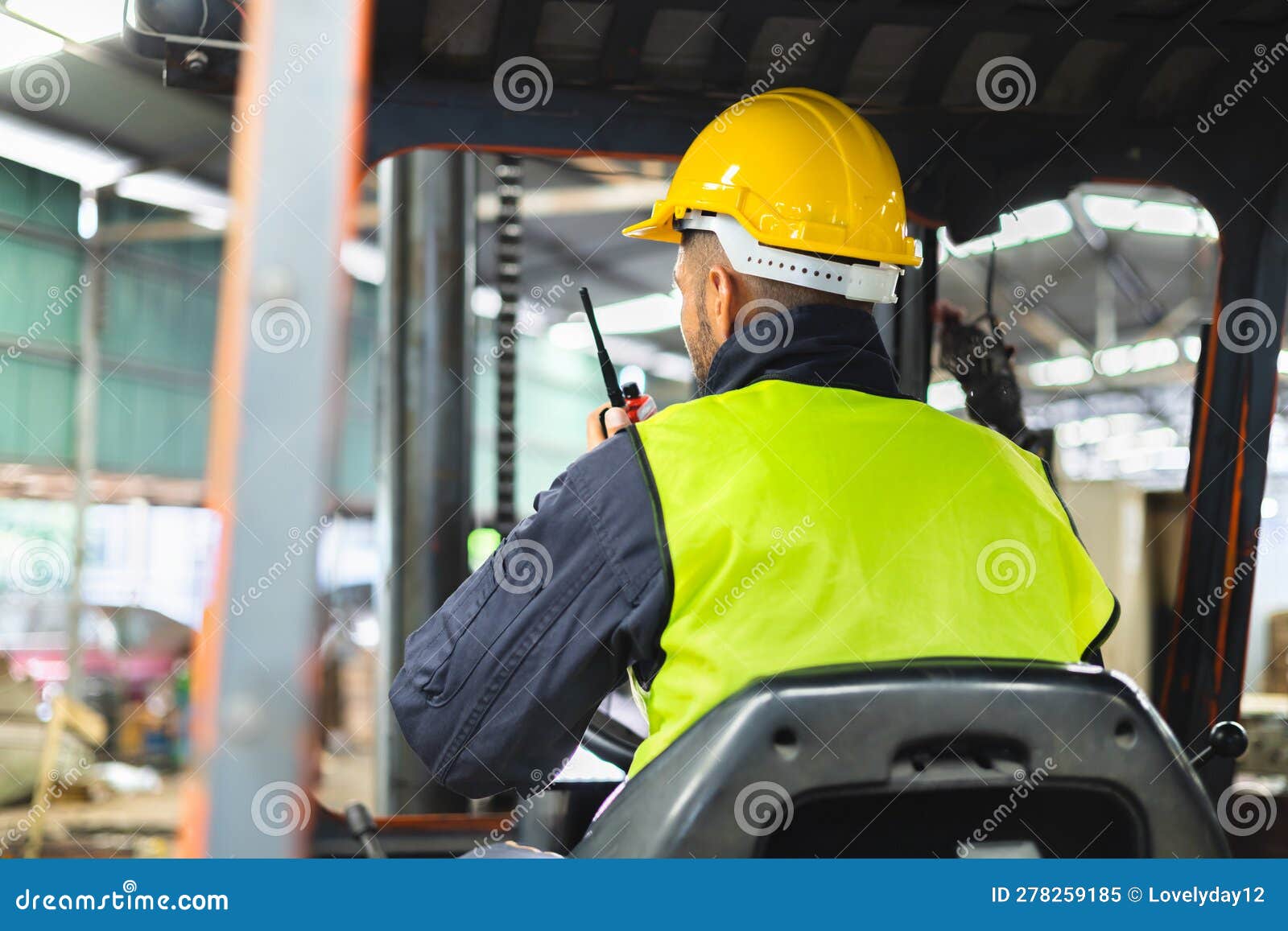 Forklift Driver Talking on Radio for Professional Cargo Shipping ...