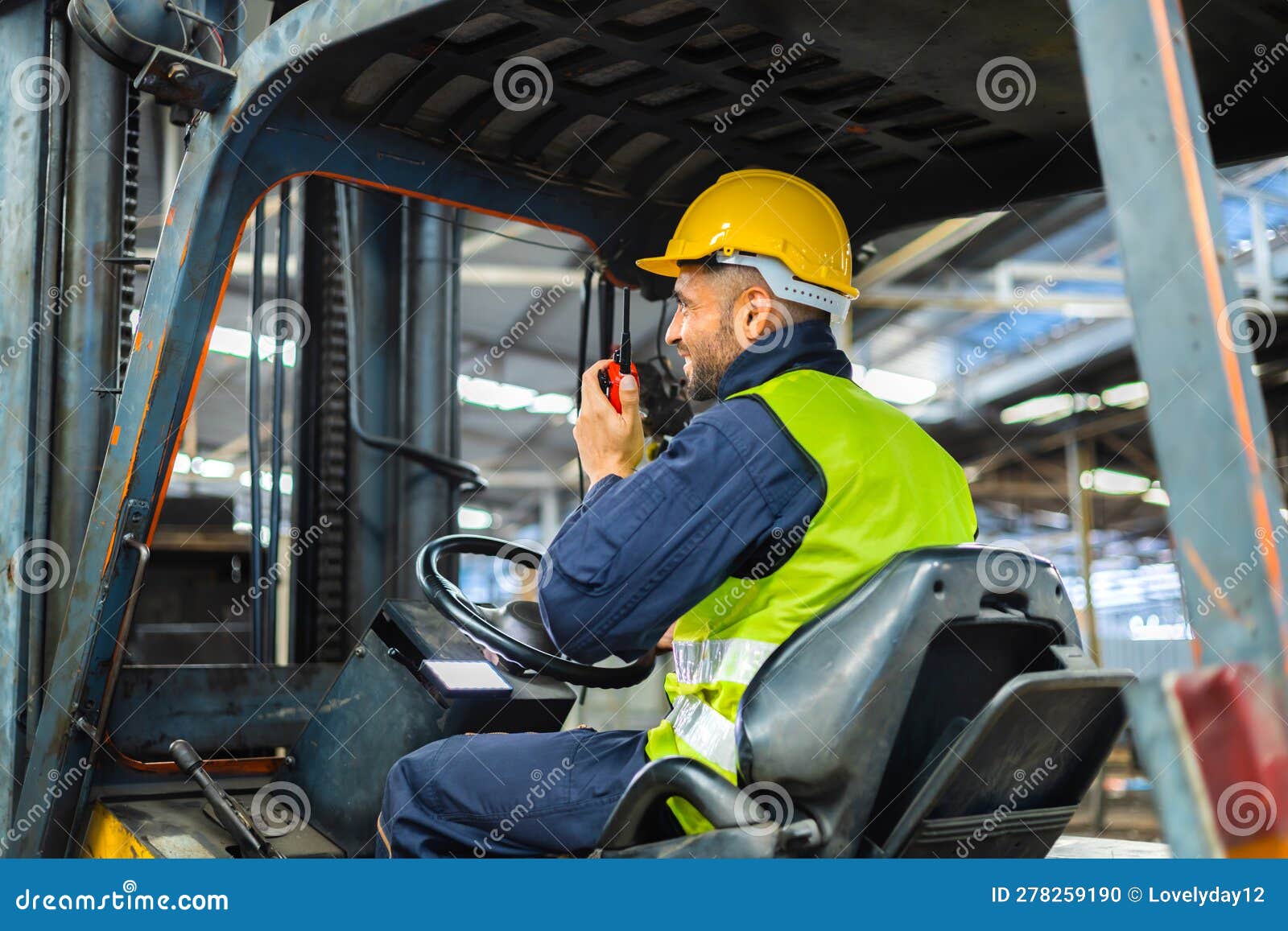 Forklift Driver Talking on Radio for Professional Cargo Shipping ...