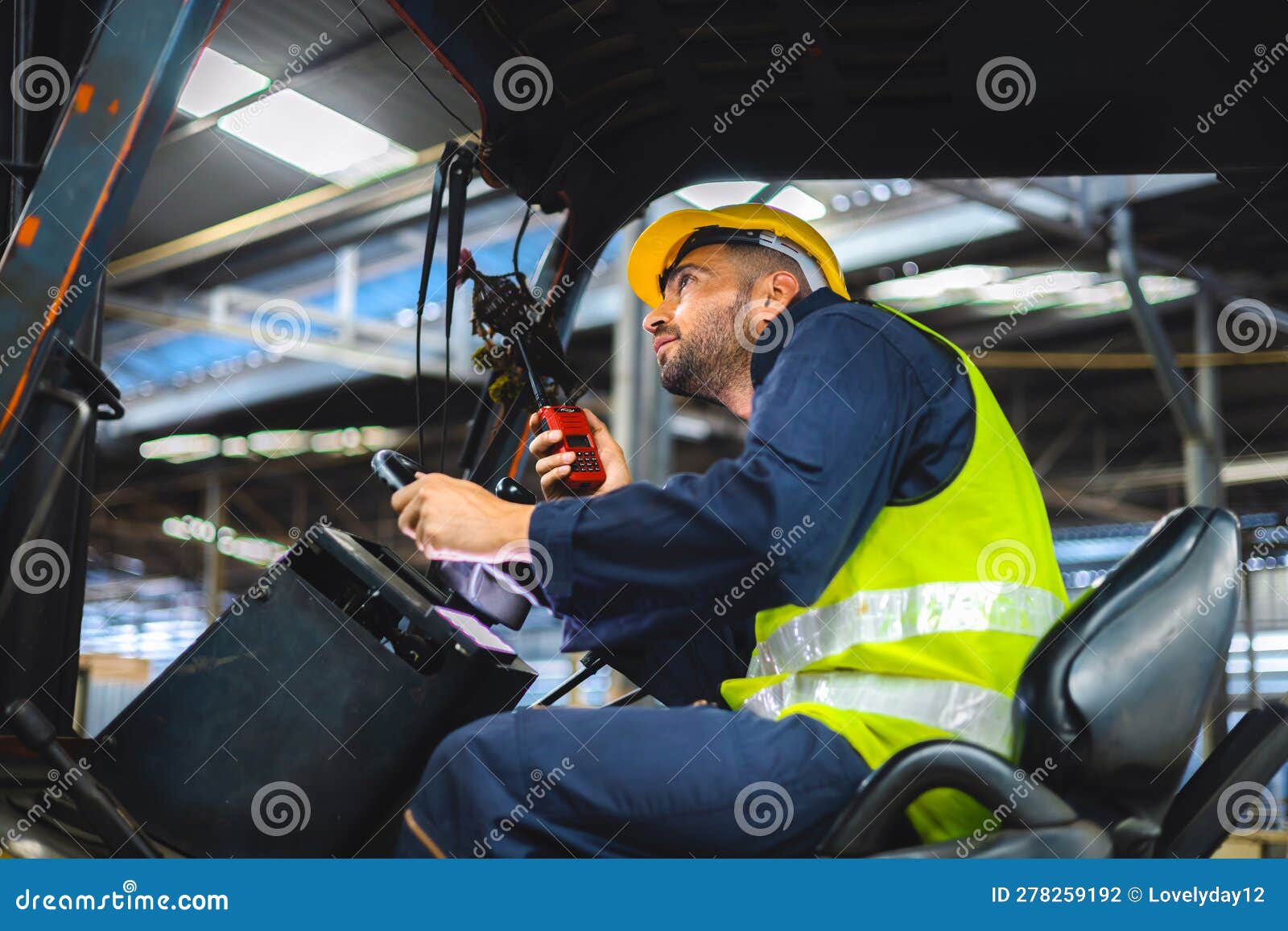 Forklift Driver Talking on Radio for Professional Cargo Shipping ...