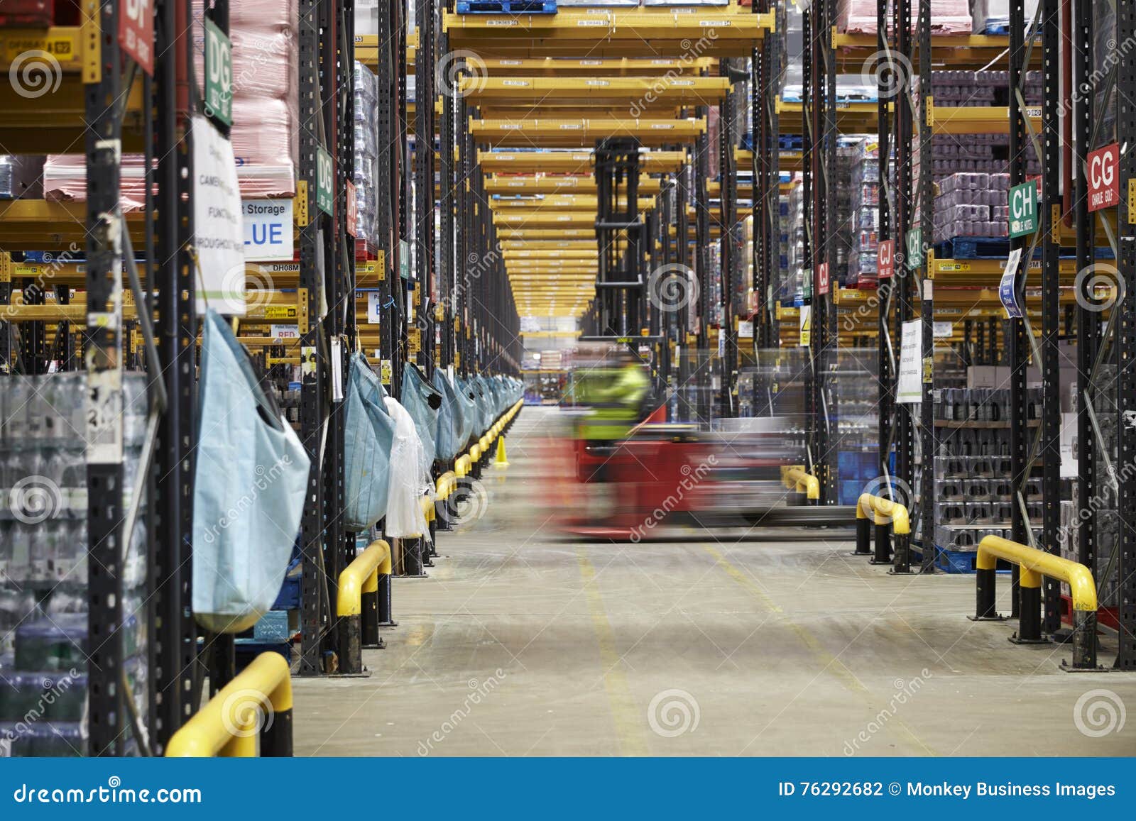 Forklift Driving Across an Aisle in a Warehouse, Motion Blur Stock ...