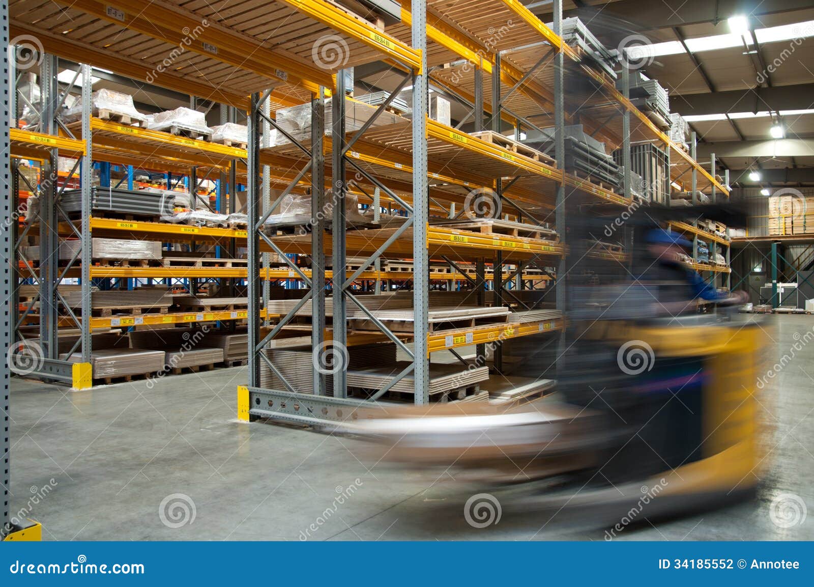 A Forklift Driving through a Warehouse Stock Photo - Image of interior ...