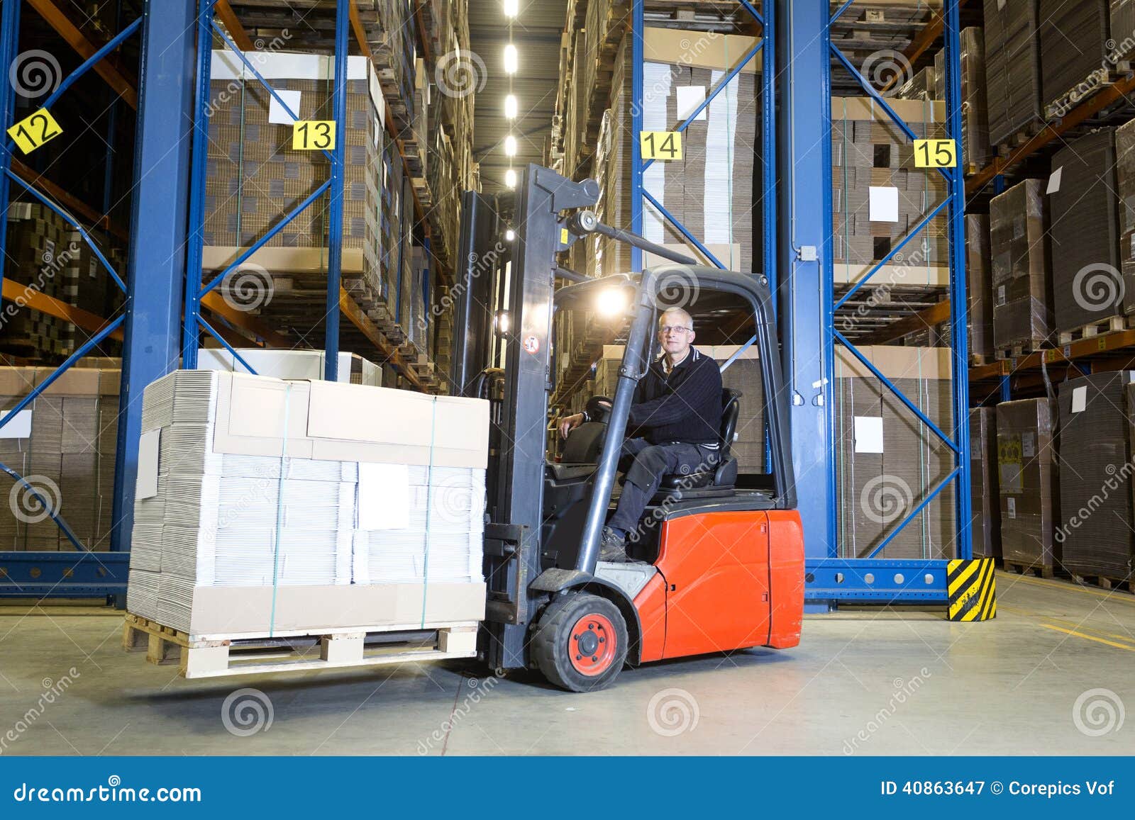 Forklift in Front of Storage Racks Stock Image - Image of cardboard ...