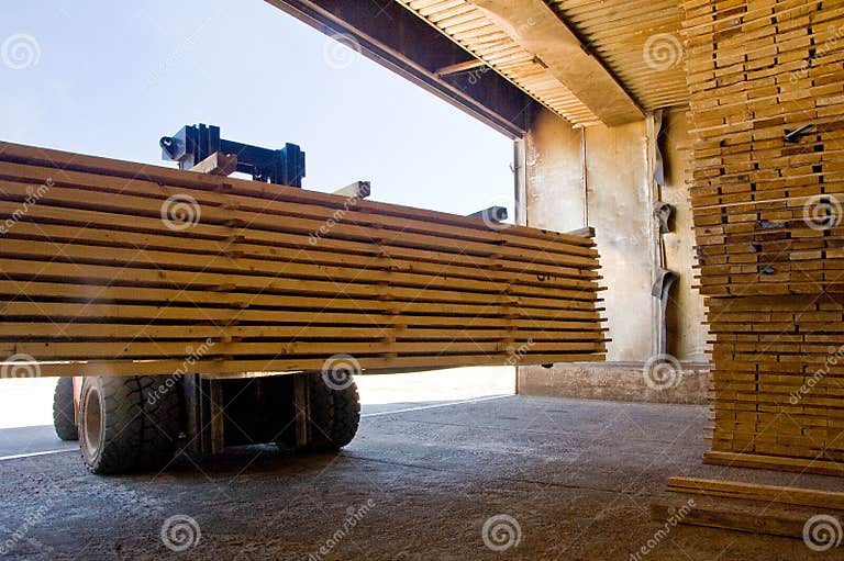 Forklift handling timber 5 stock image. Image of heavy - 5686235