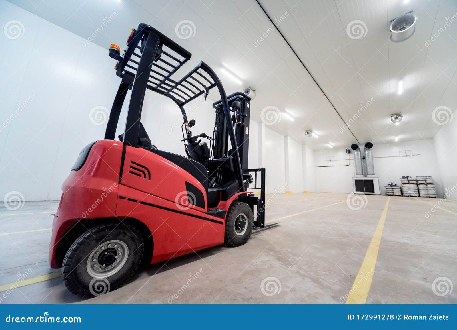 Forklift in a Large Industrial Freezer Warehouse. Stock Photo - Image ...