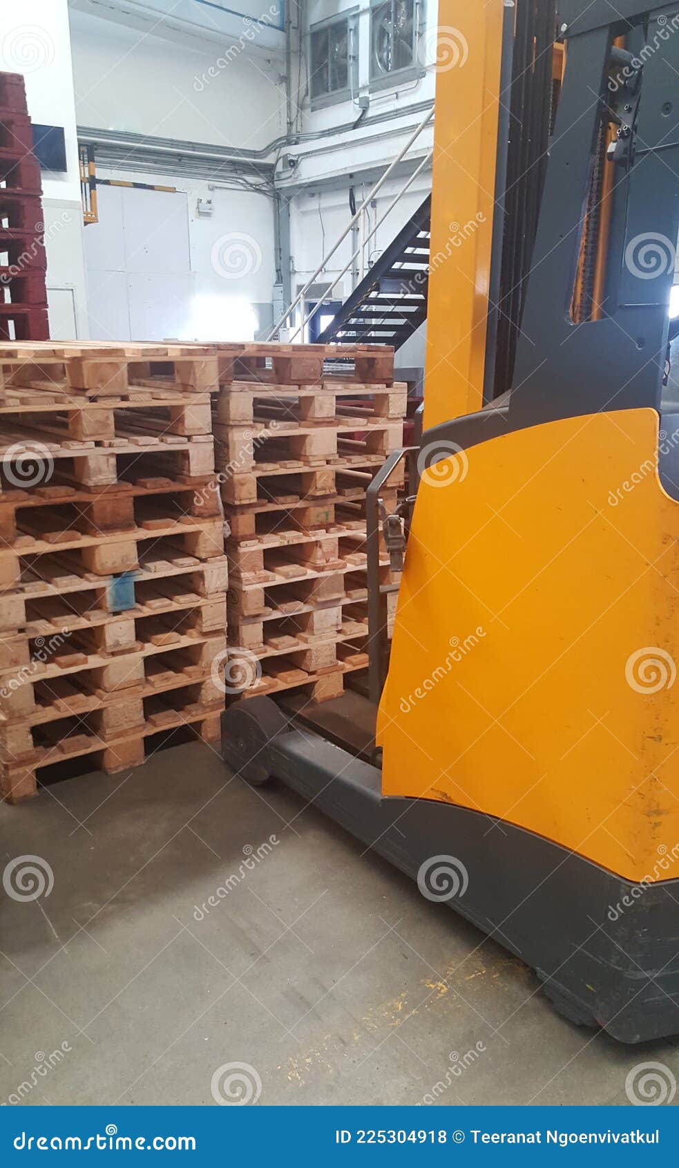 Forklift Leg in Front of Pallet Stacking in the Loading Warehouse Dock ...