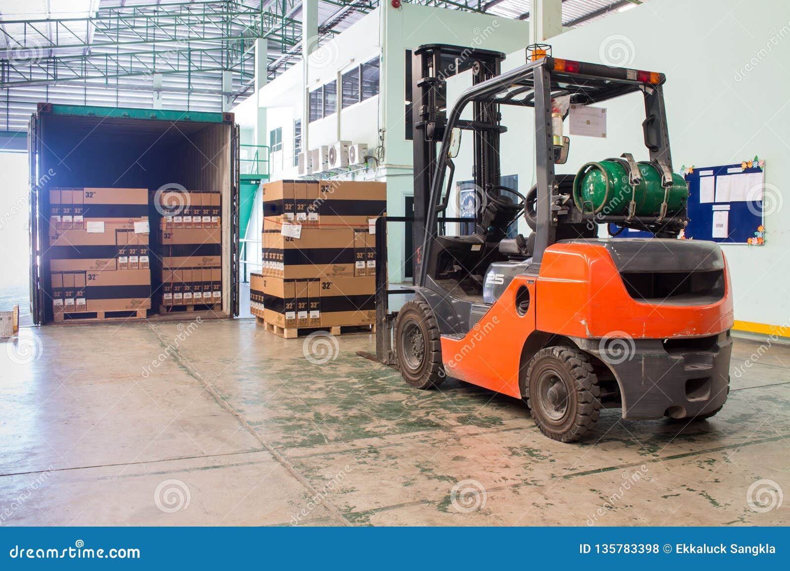 The Forklift Loading Pallet With A Forklift Into A Truck Stock ...