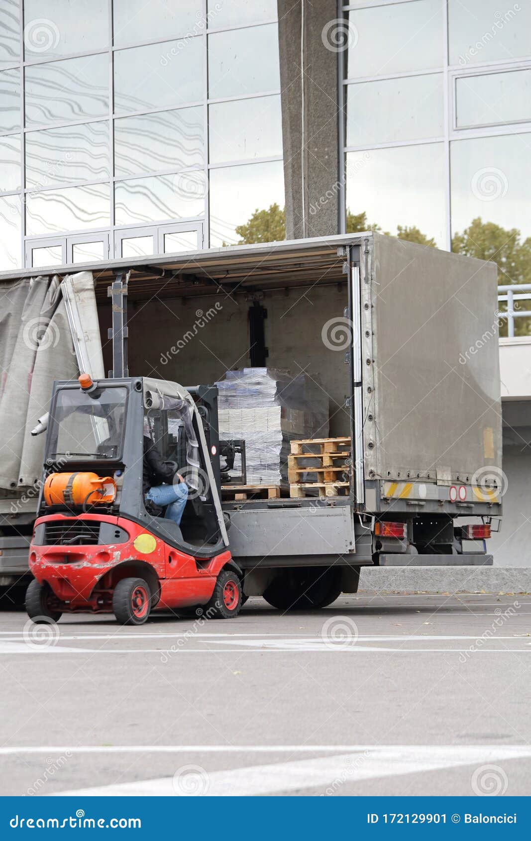 Forklift Loading Truck stock image. Image of material - 172129901