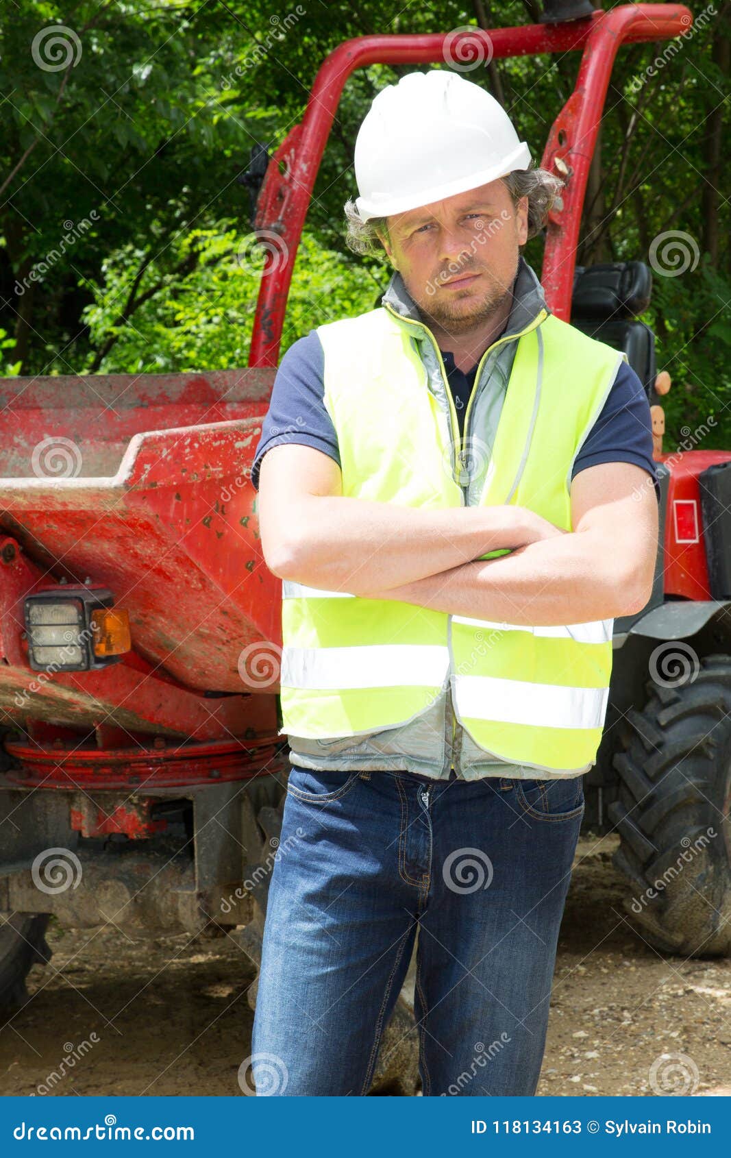 A Forklift Man Driver in Yellow Security Clothes at the Construction ...