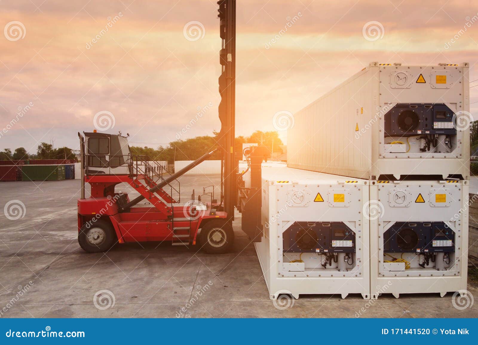 Forklift Reach Stacker Is Lifting Reefer Container In The Depot ...