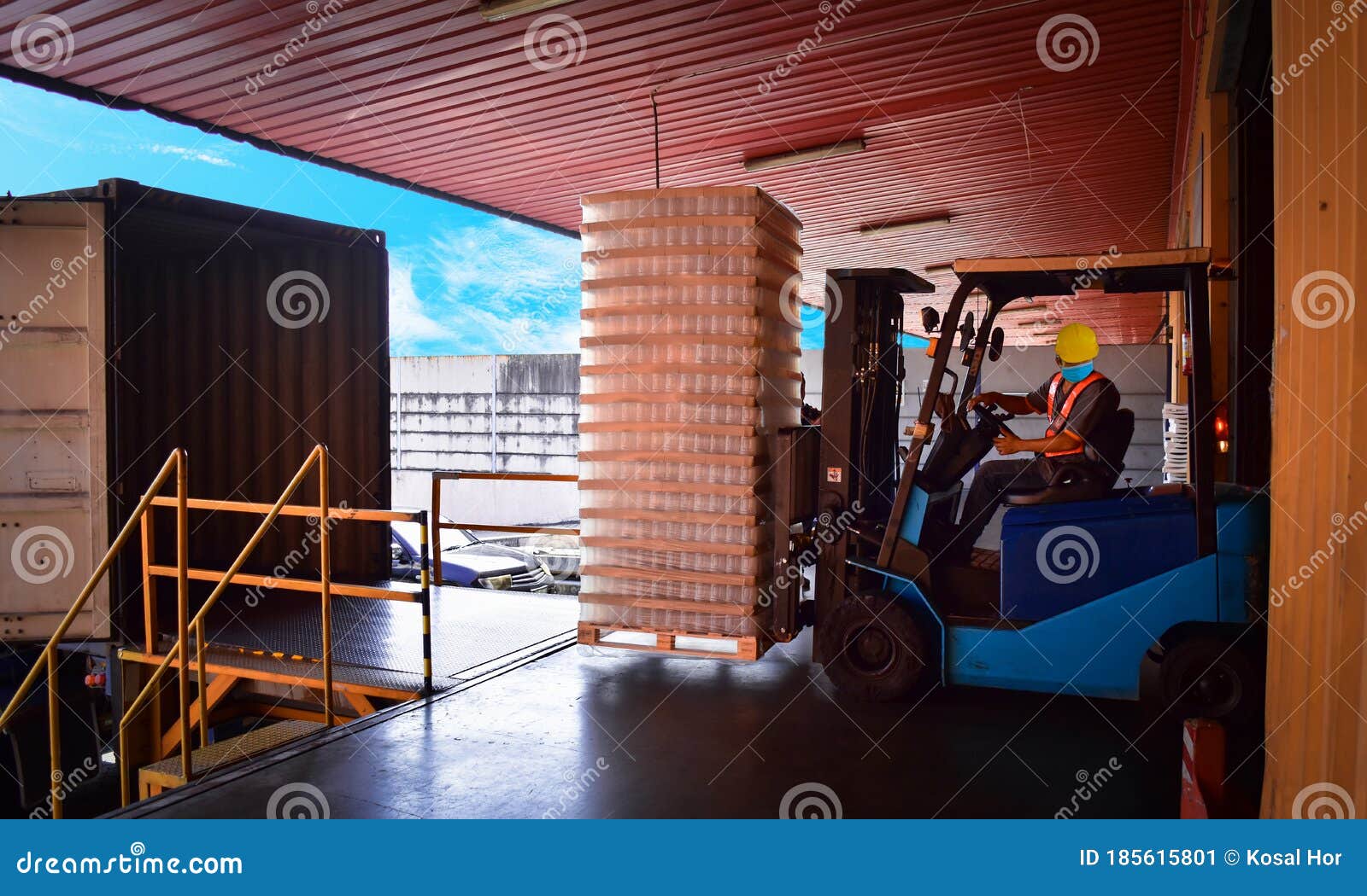 Forklift Stuffing-unstuffing Pallets of Cargo To Container on Warehouse ...