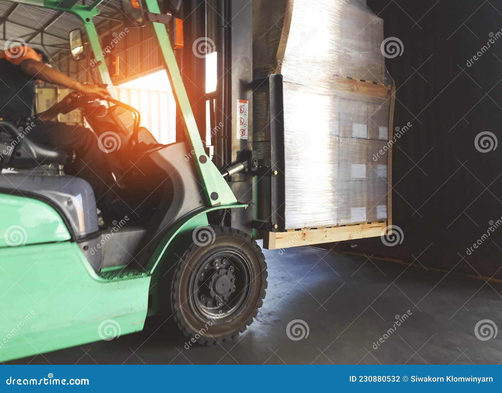 Forklift Tractor Loading Package Boxes into Container at Dock Warehouse ...