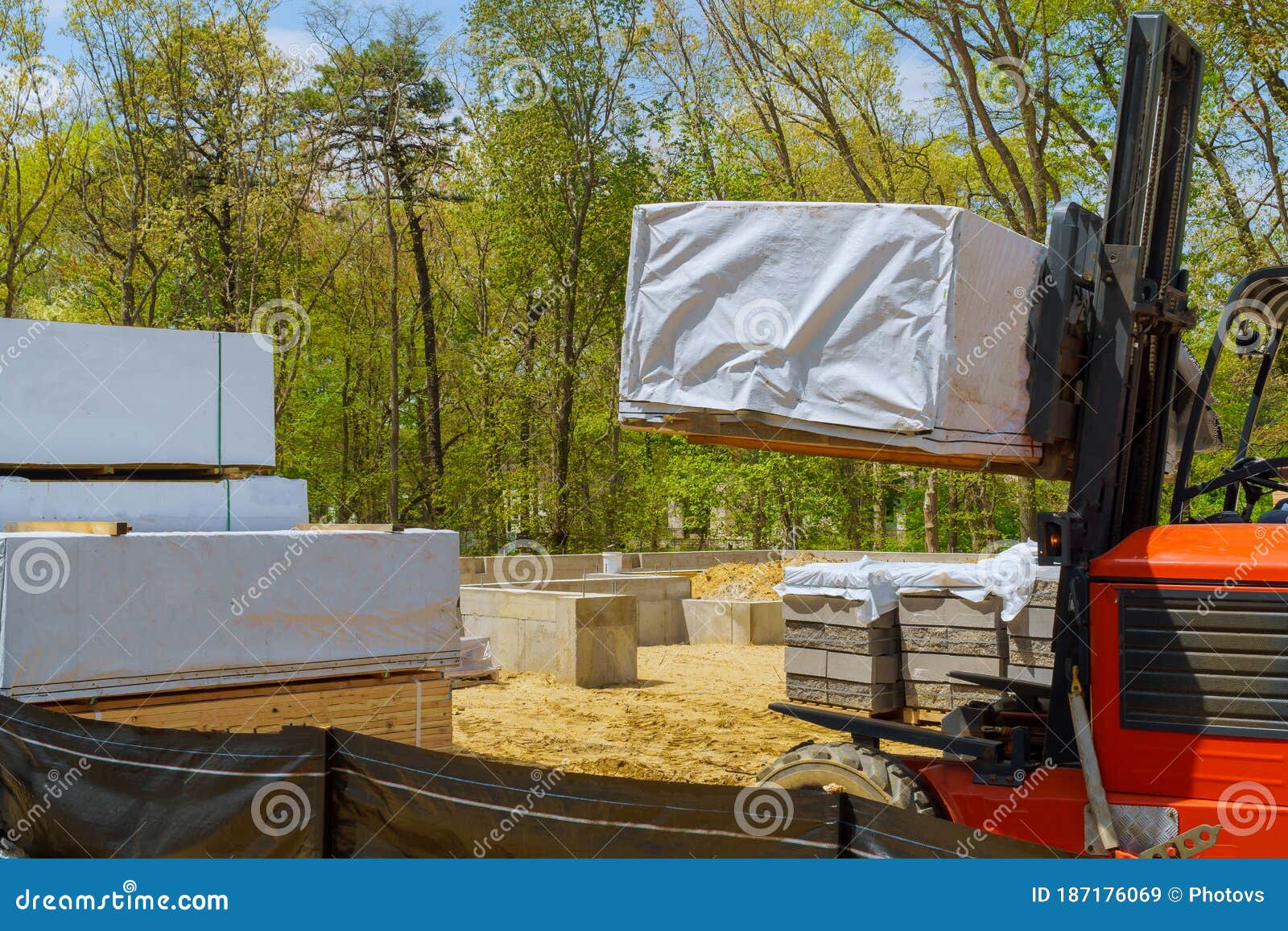 Forklift Truck Driver in an Industrial Area Built Home Under ...