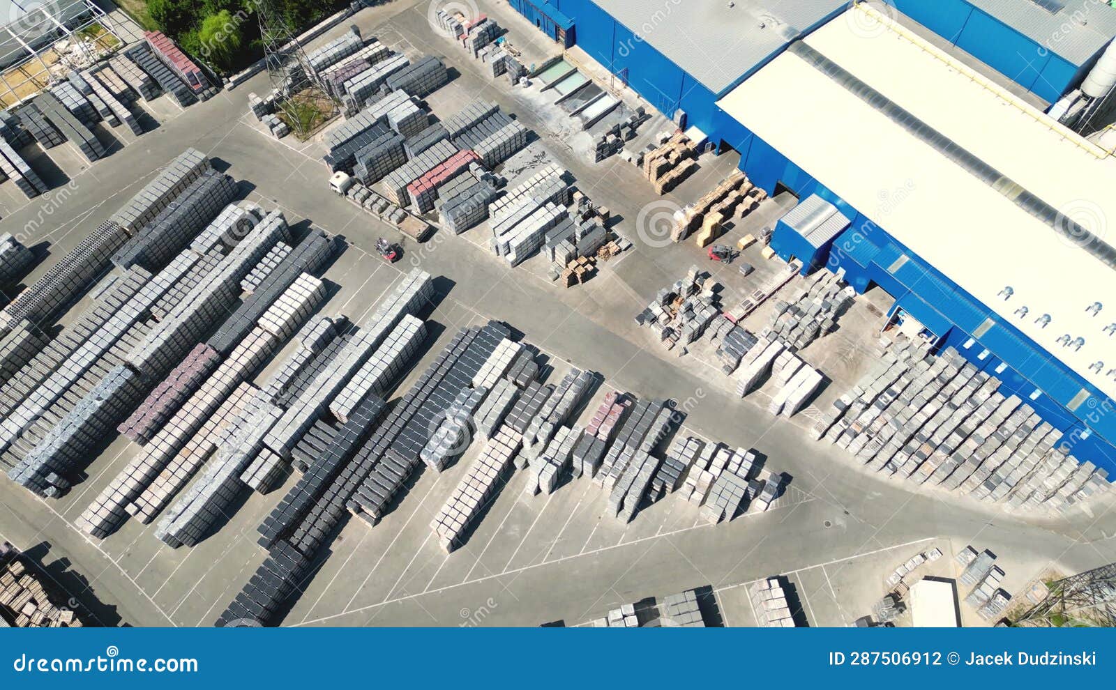 Forklift Truck Driver in Warehouse Driving between Rows of Shelving ...