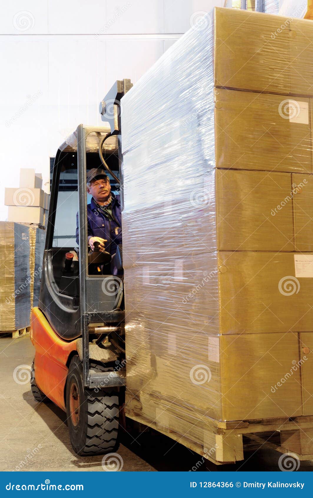 Forklift Worker in Loader at Stock Photo - Image of cardboard ...