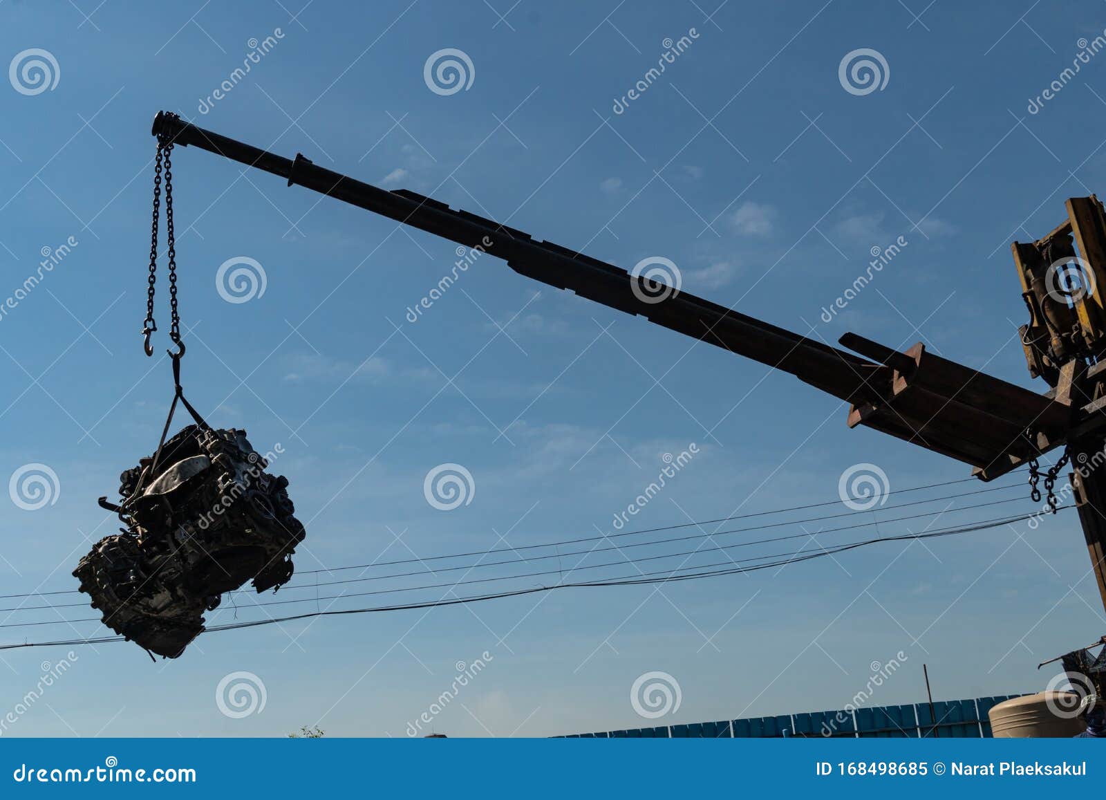 A Forklift and Workers are Lifting an Old Car`s Engine for Recycling ...