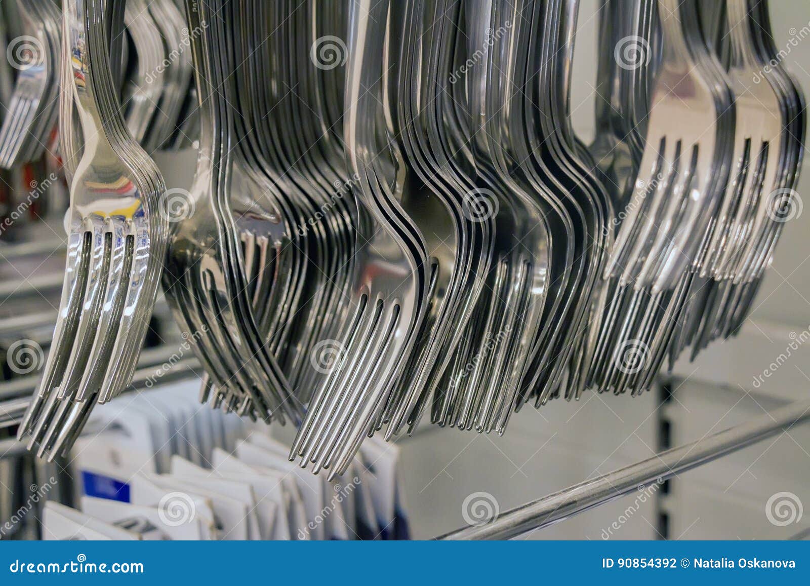 Forks hang in store stock photo. Image of equipment, department - 90854392