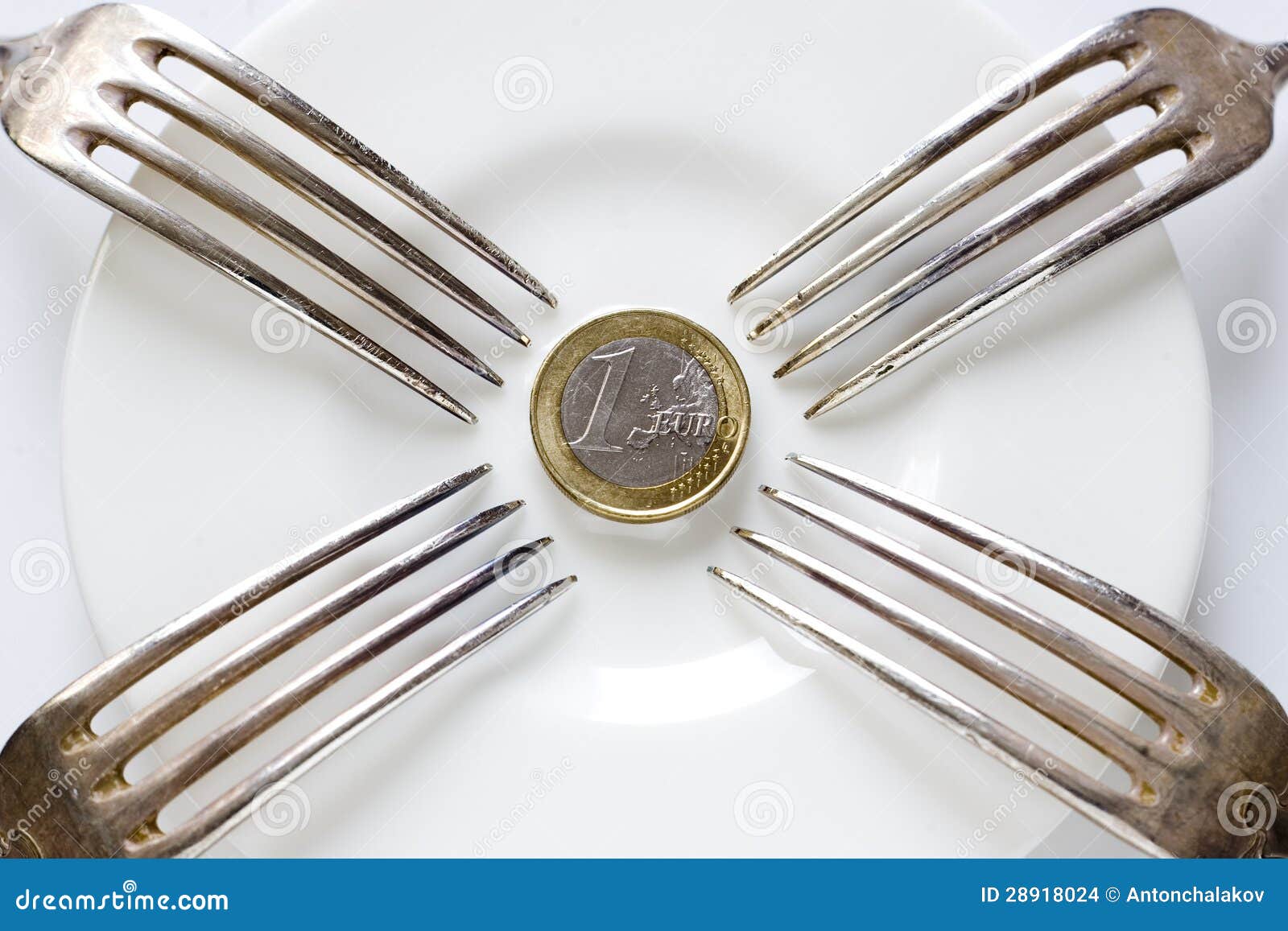 Forks stuck in euro coin stock photo. Image of financial - 28918024