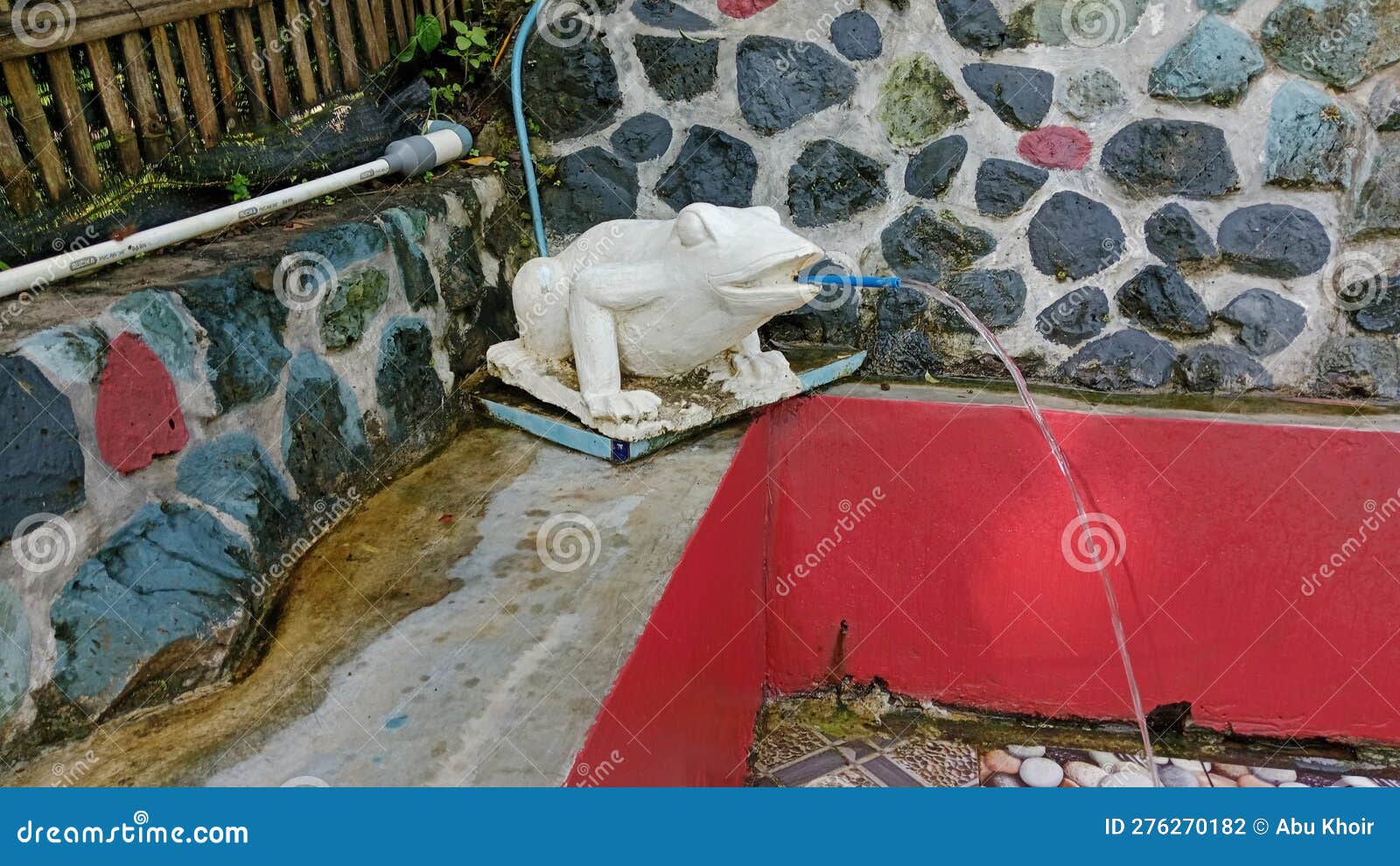 The Form of a White Frog Statue that Flows the Gurgling Water in the ...