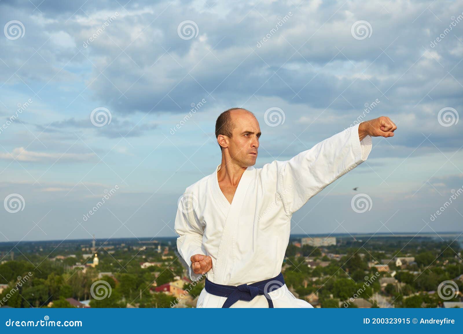 Formal Exercises Karate Athlete Performs on the Background of the City ...