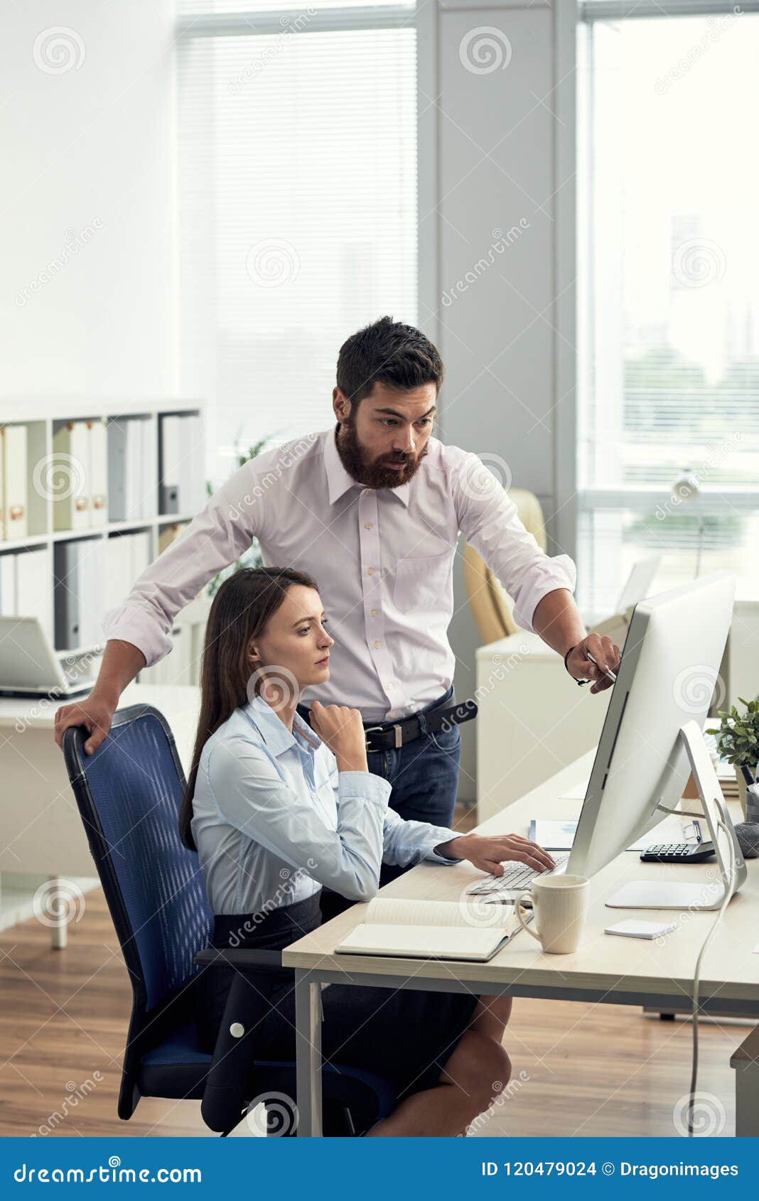 Colleagues Using Computer and Talking Stock Photo - Image of digital ...
