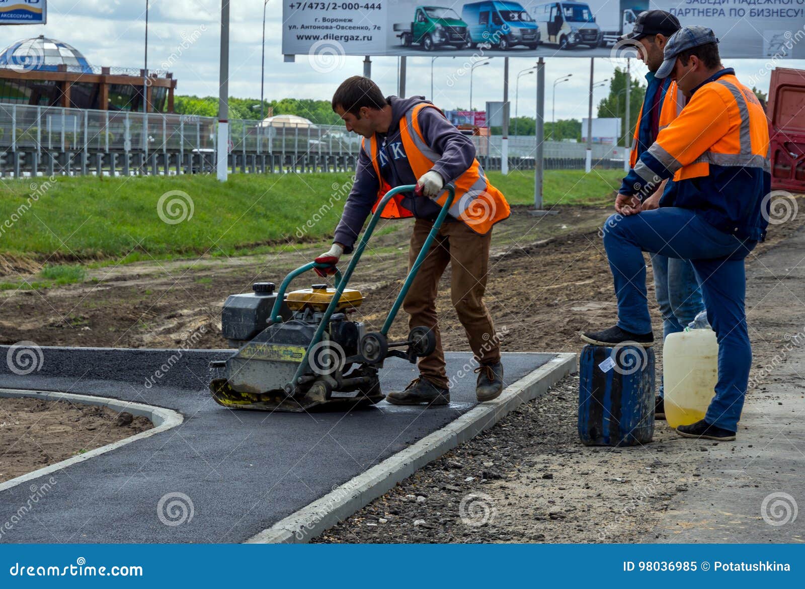 Formation of an Asphalt Layer on the Sidewalk Using a Vibrating Machine ...