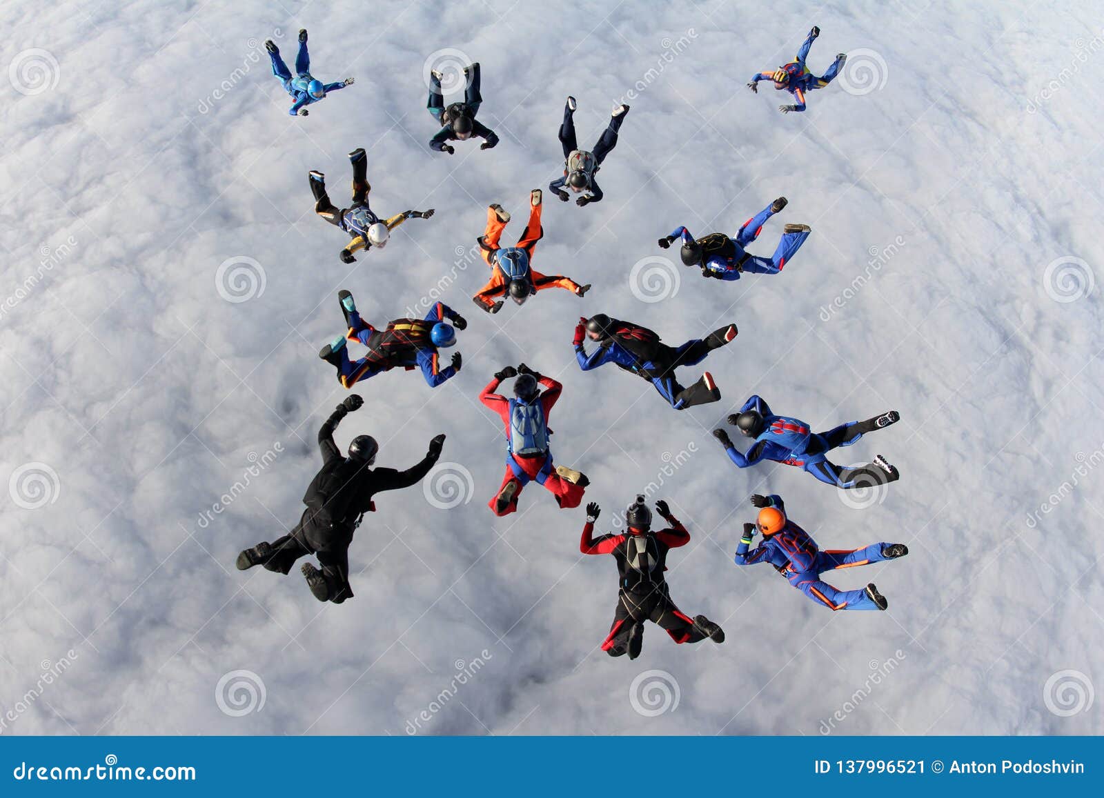 Formation Skydiving.a Big Group of Skydivers is in the Sky Above White ...
