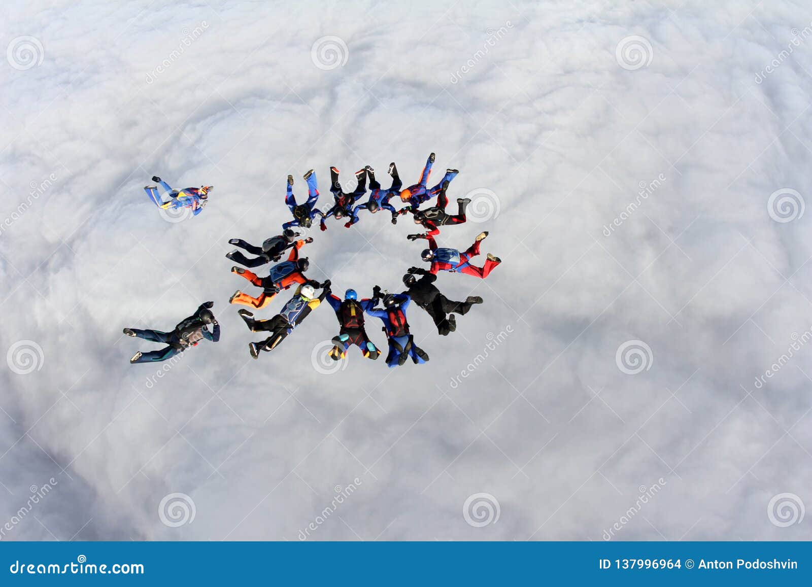Formation Skydiving.a Big Group of Skydivers is in the Sky Above White ...