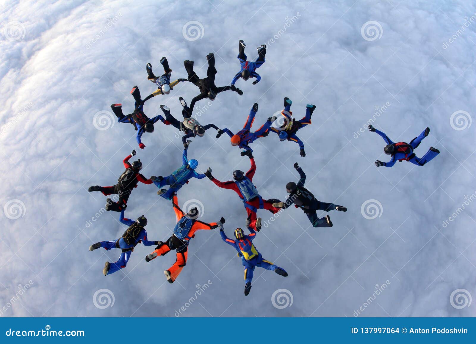 Formation Skydiving.a Big Group of Skydivers is in the Sky Above White ...