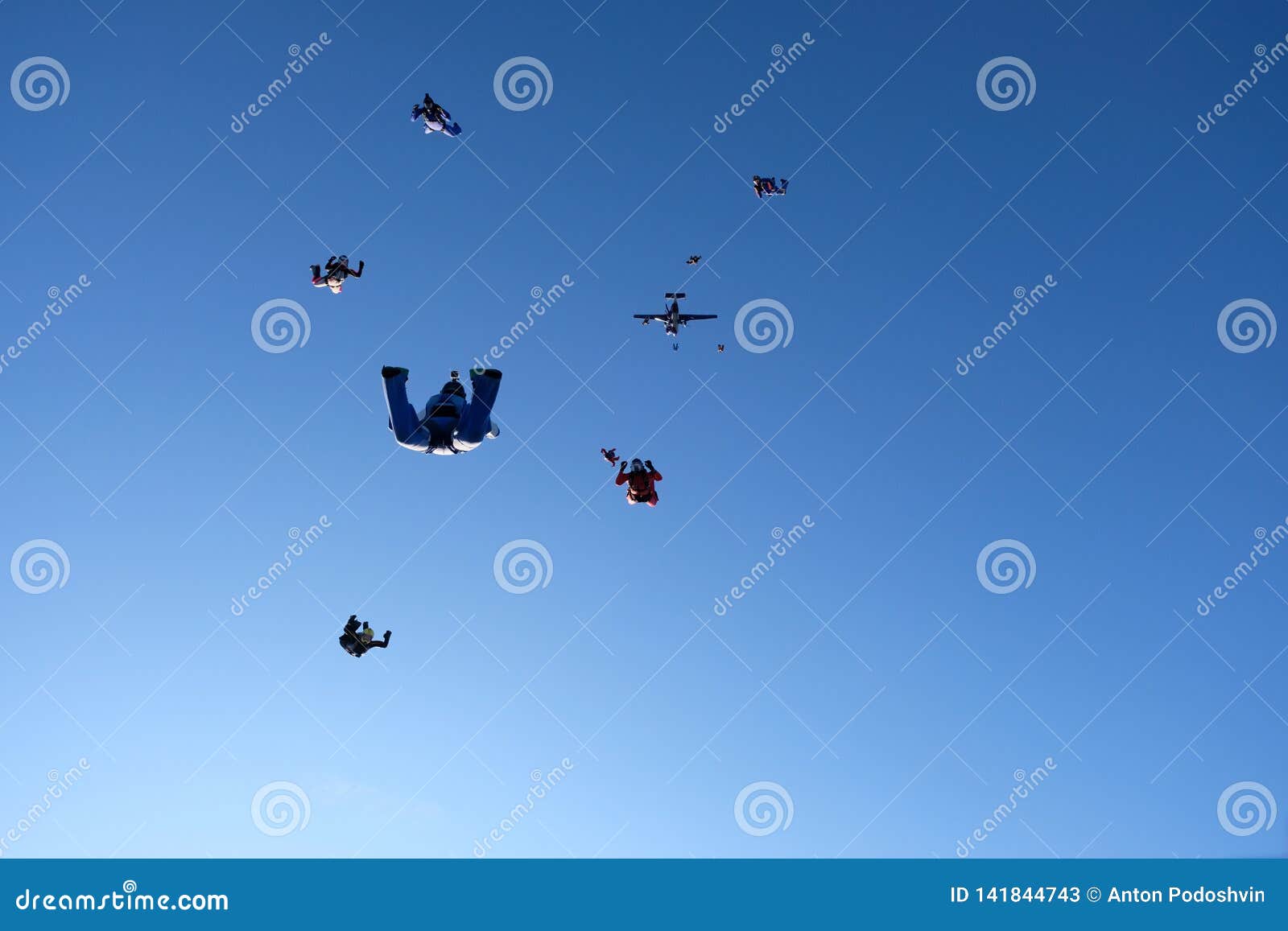 Formation Skydiving. Skydivers are Doing a Figure in the Sky. Editorial ...