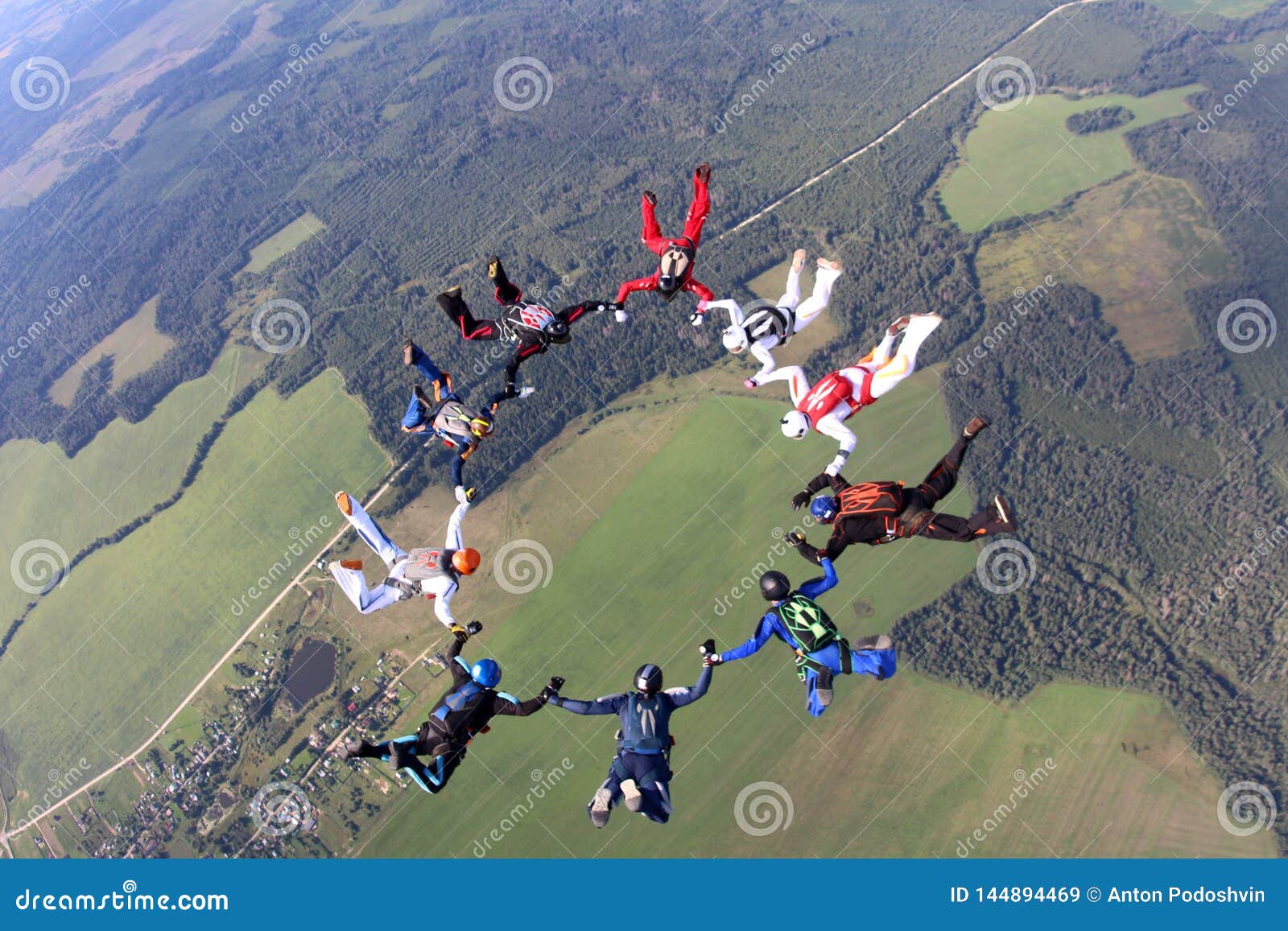 Formation Skydiving. Skydivers Have Done a Circle in the Sky. Editorial ...
