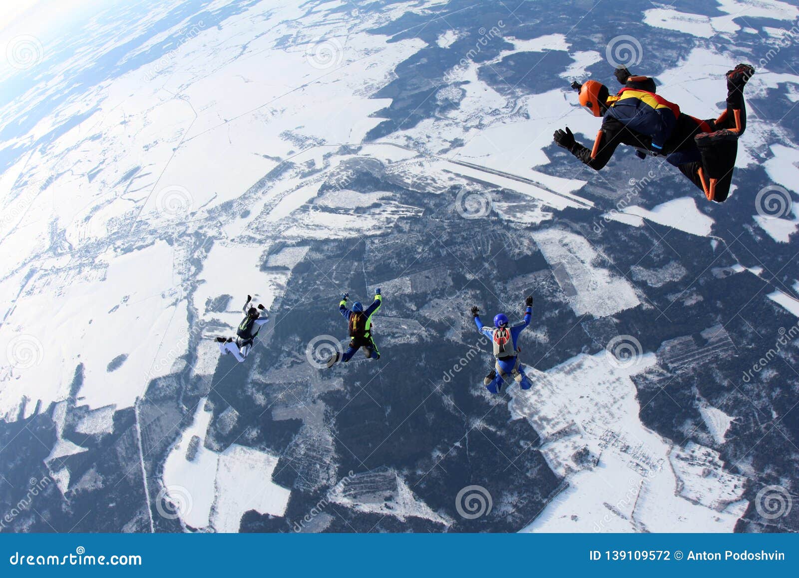 Formation Skydiving in the Winter Sky Above Snowy Fields. Editorial ...