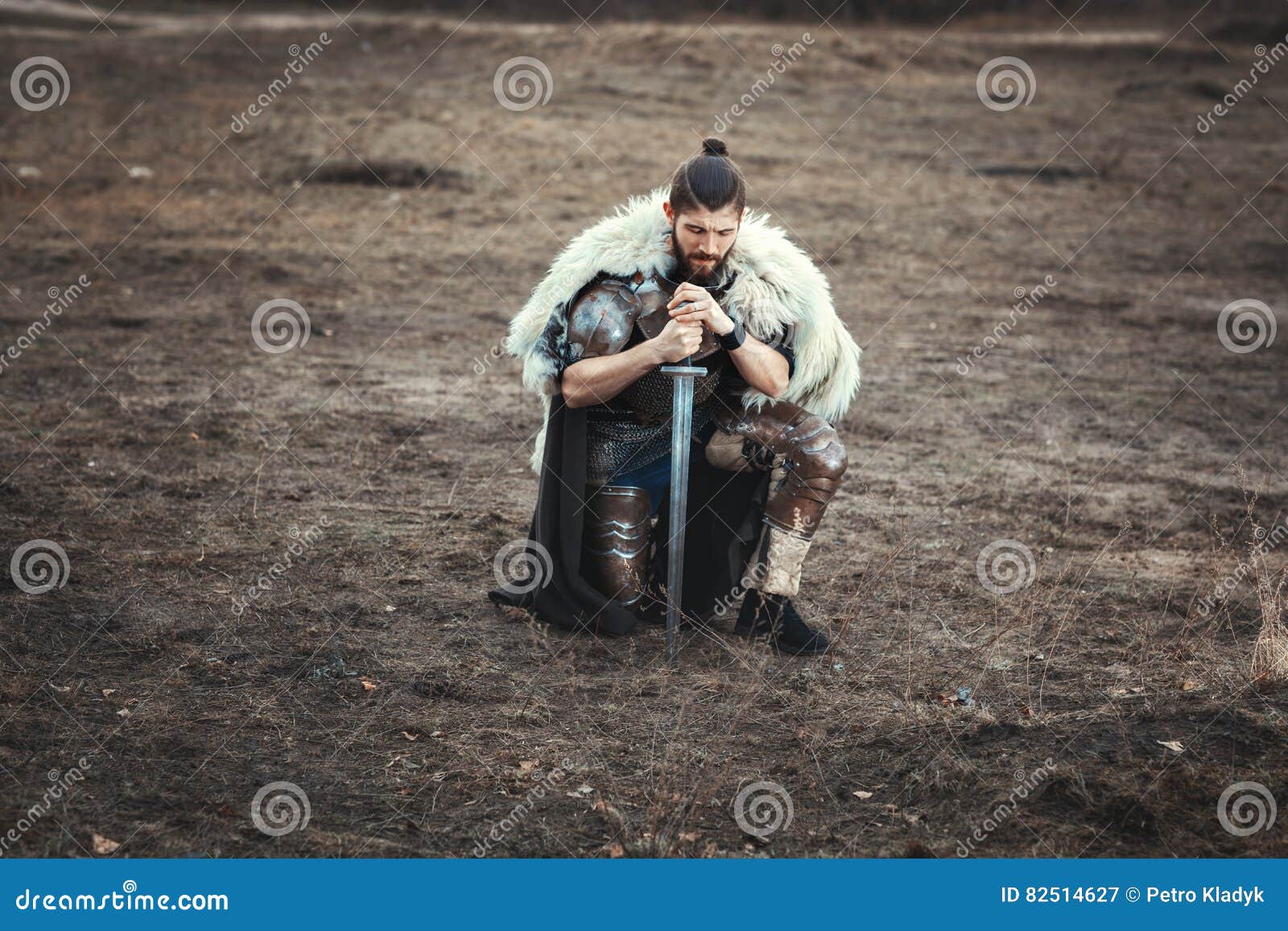 Formidable Man with a Sword in Field Sad. Stock Image - Image of ...