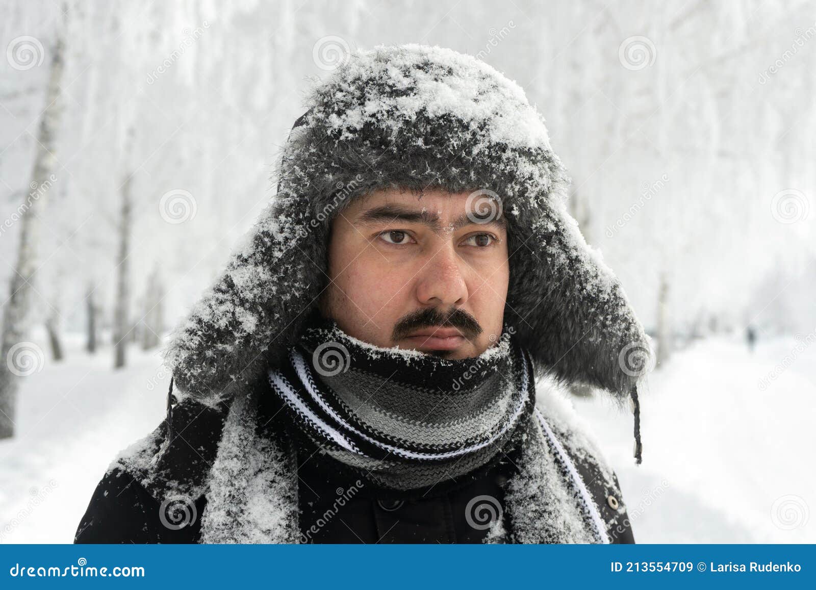 Formidable Russian Man in a Winter Hat and Scarf with a Stern Look ...