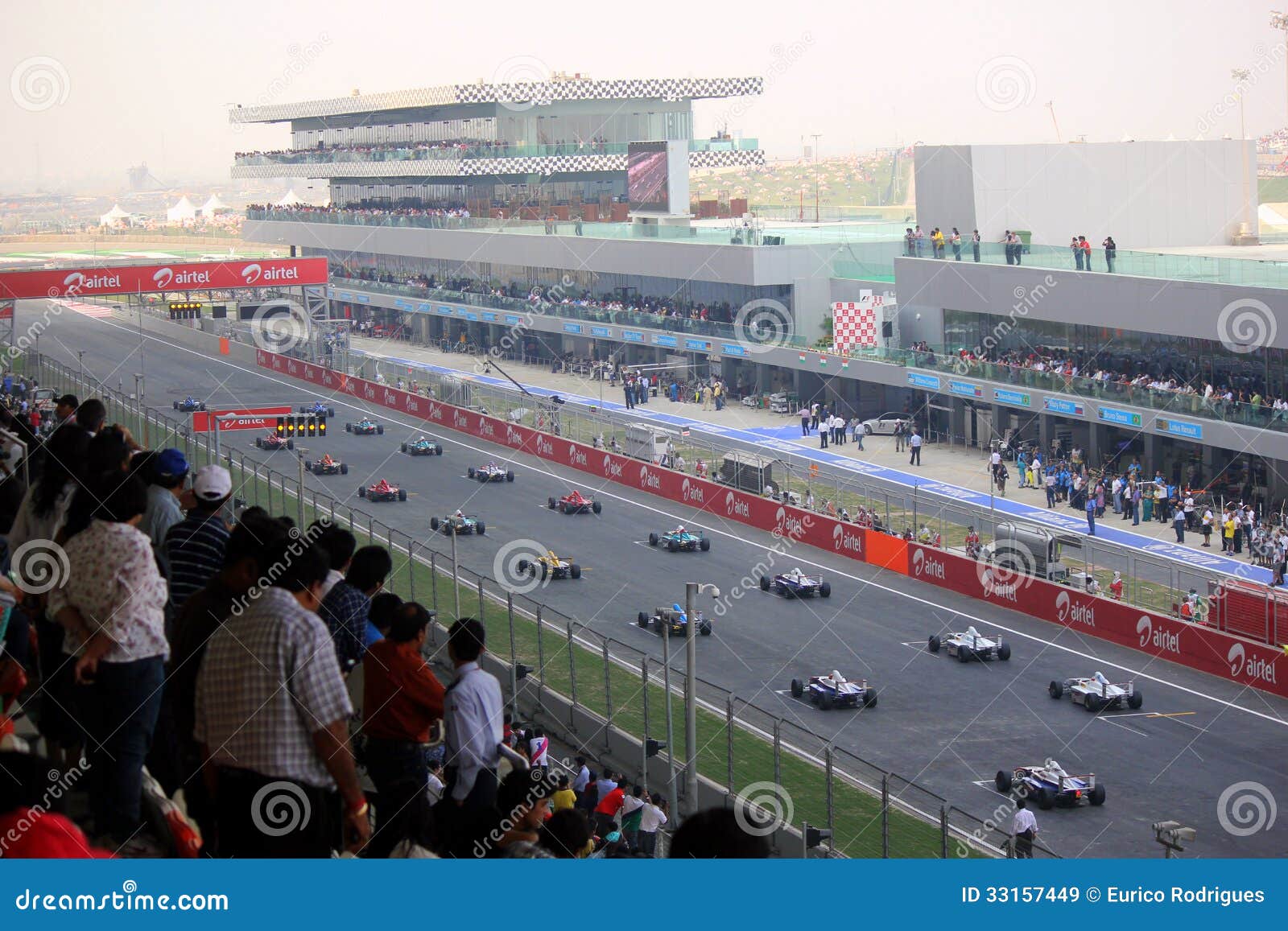 Formula Car On Starting Grid Team People Working On Wet Slick Race ...